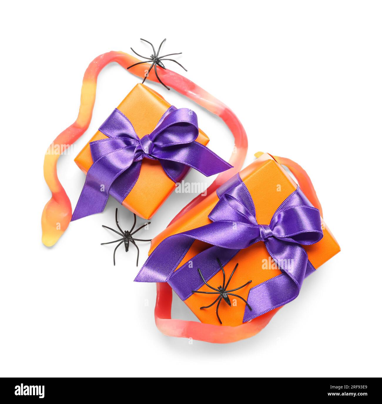 Tasty candy in shape of snake, spiders and gift boxes for Halloween on ...