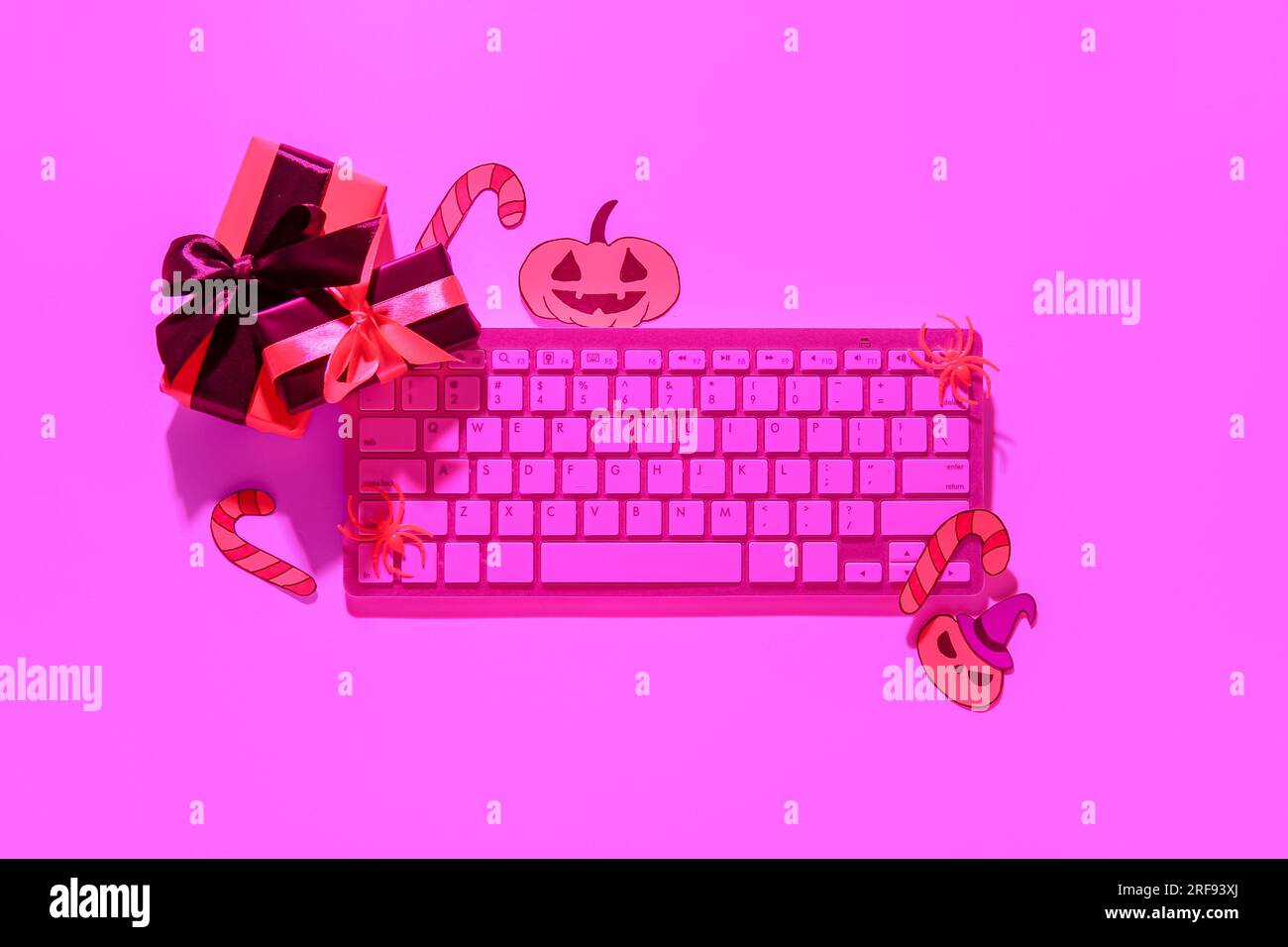 Composition with modern computer keyboard, gift boxes and Halloween ...