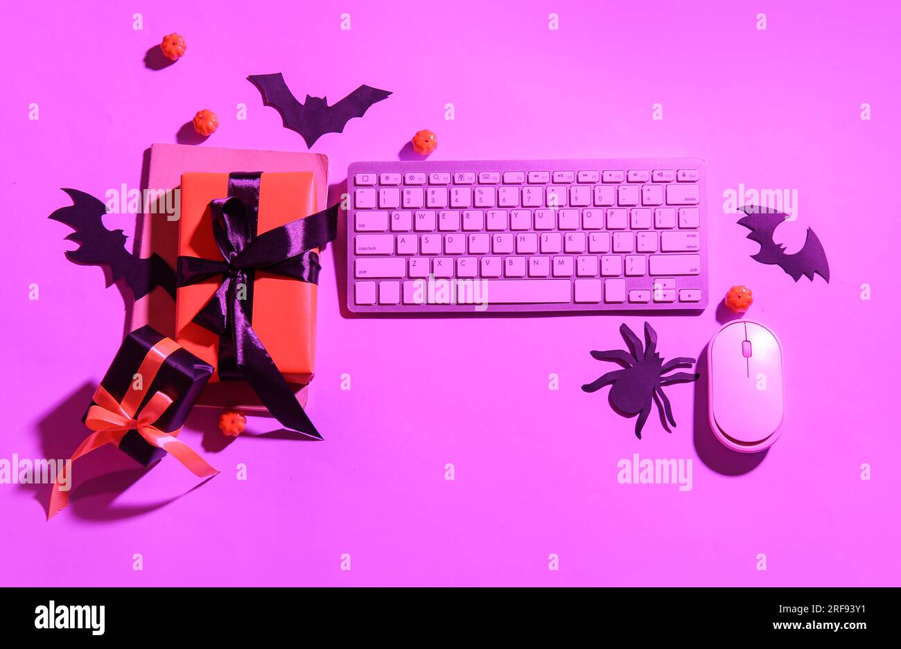 Composition with modern computer keyboard, mouse, gift boxes and ...