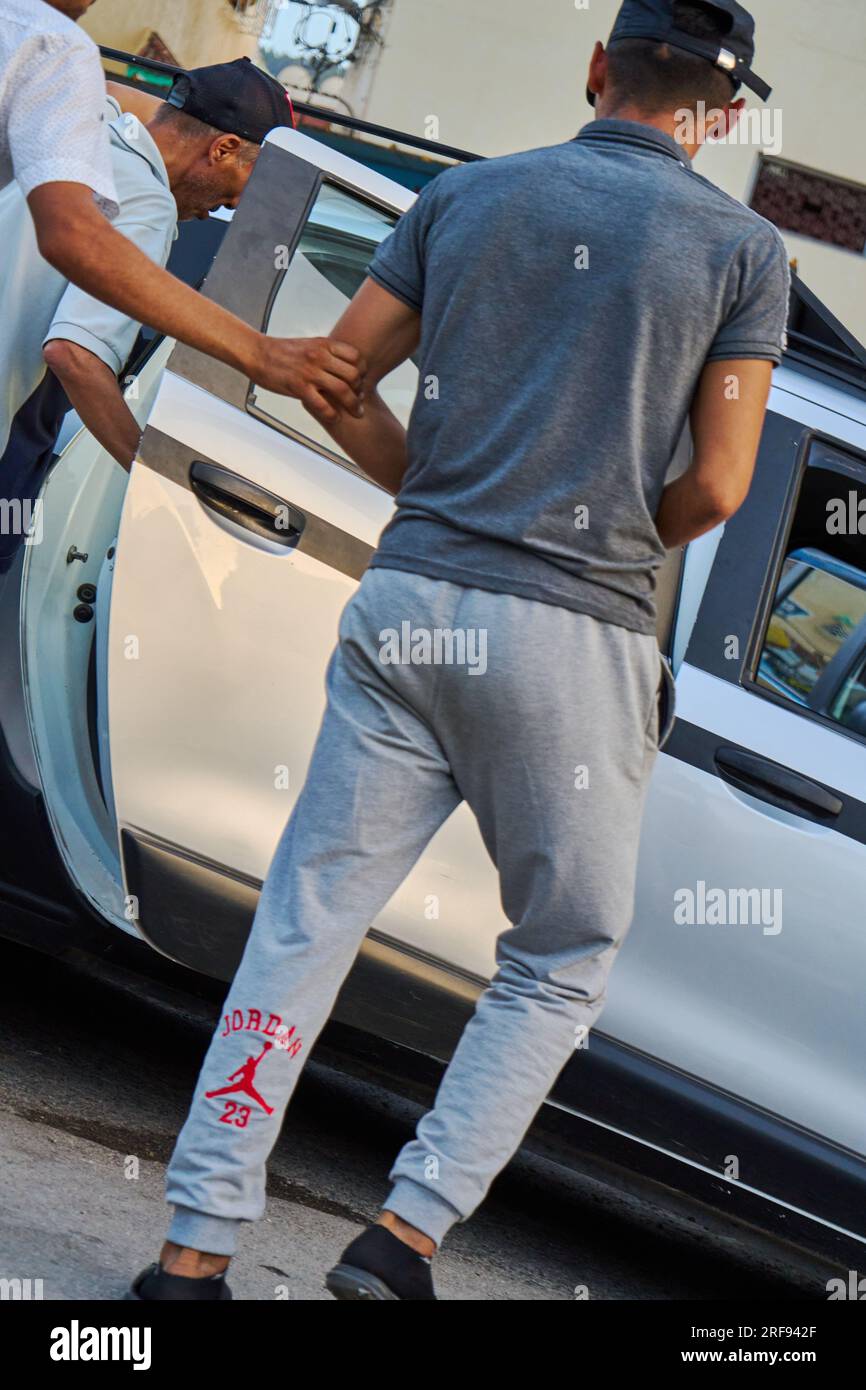 tree people with a car Stock Photo - Alamy