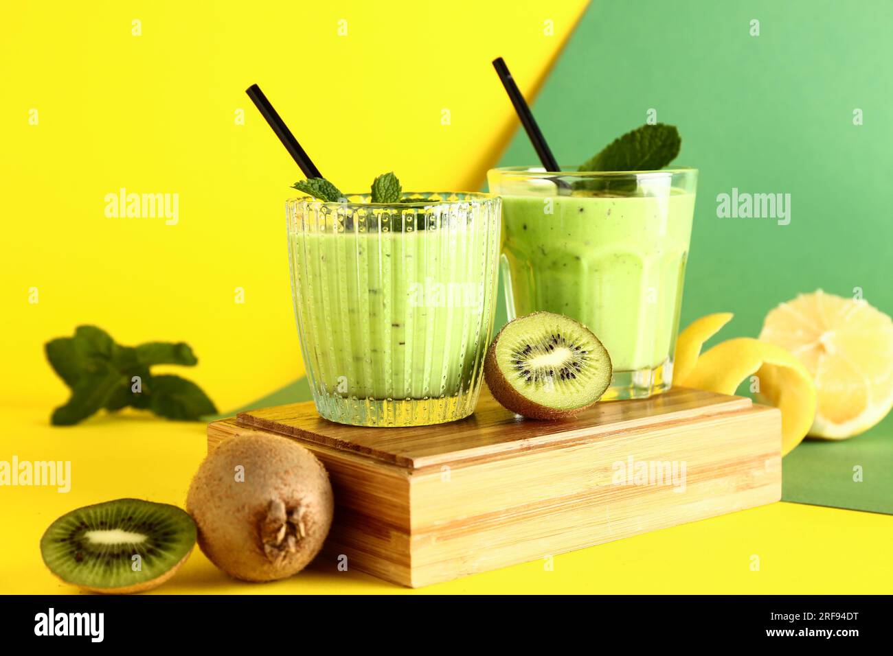 Glasses Of Fresh Kiwi Smoothie With Mint And Lemon On Colorful