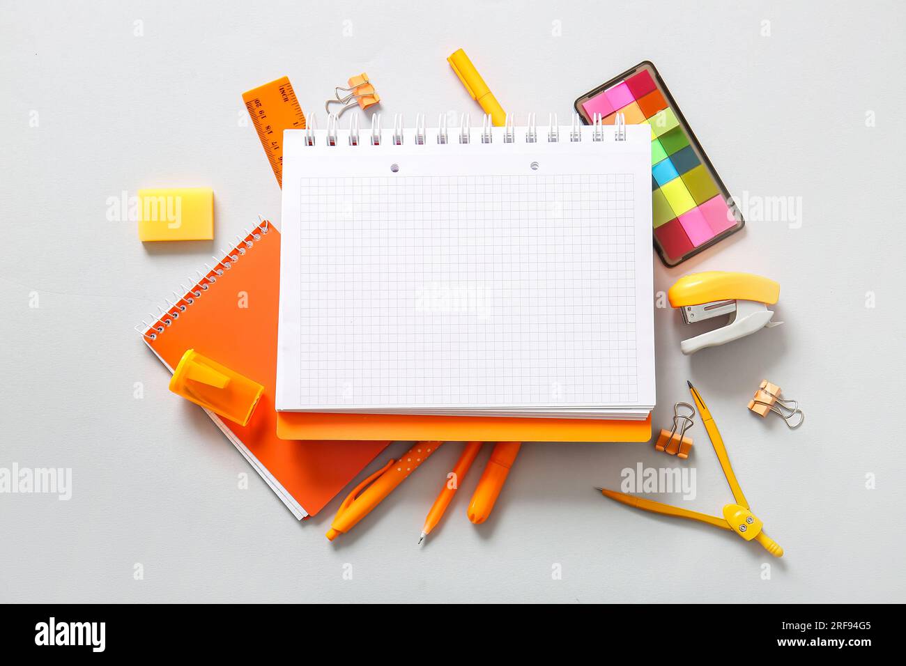 Composition with blank notebook and different school stationery on ...