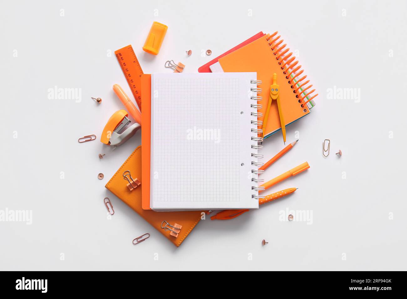 Composition with blank notebook and different school stationery on ...