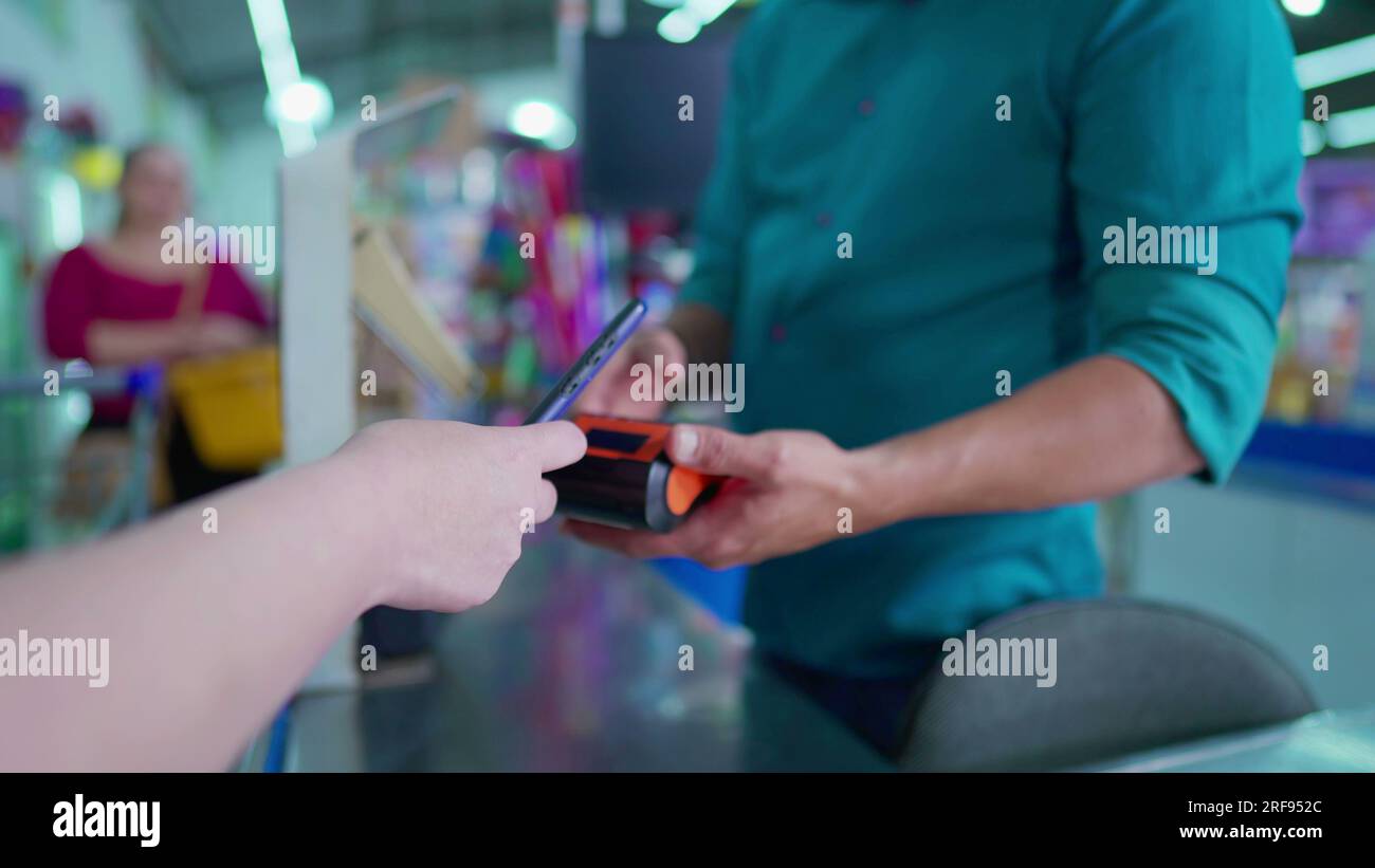 Supermarket Checkout Employee Cashier Processing Payment with ...