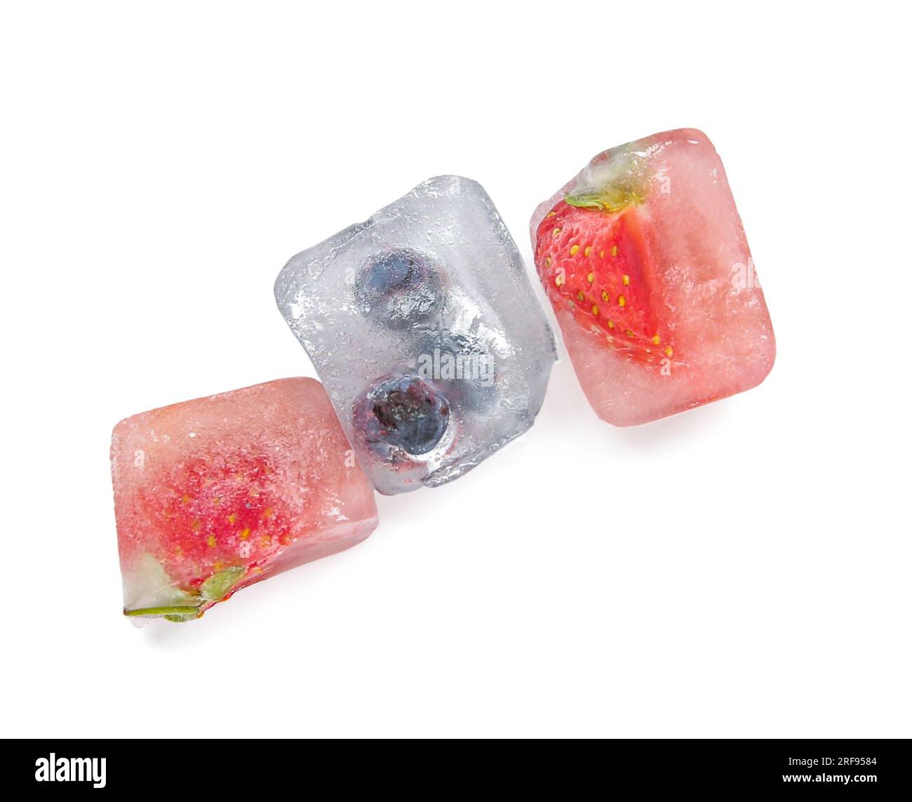 Frozen berries in ice cubes on white background Stock Photo - Alamy