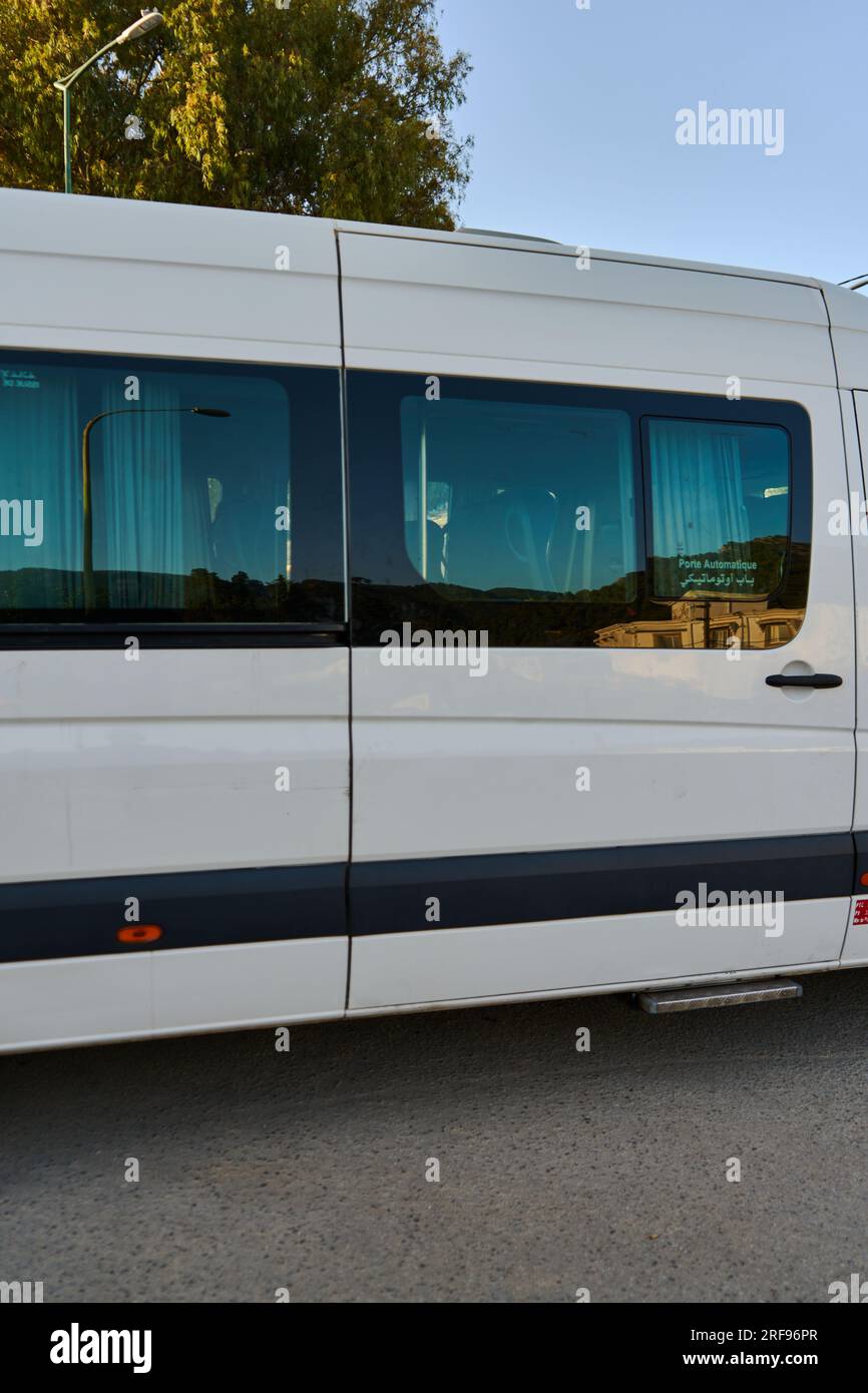White bus in the street Stock Photo - Alamy