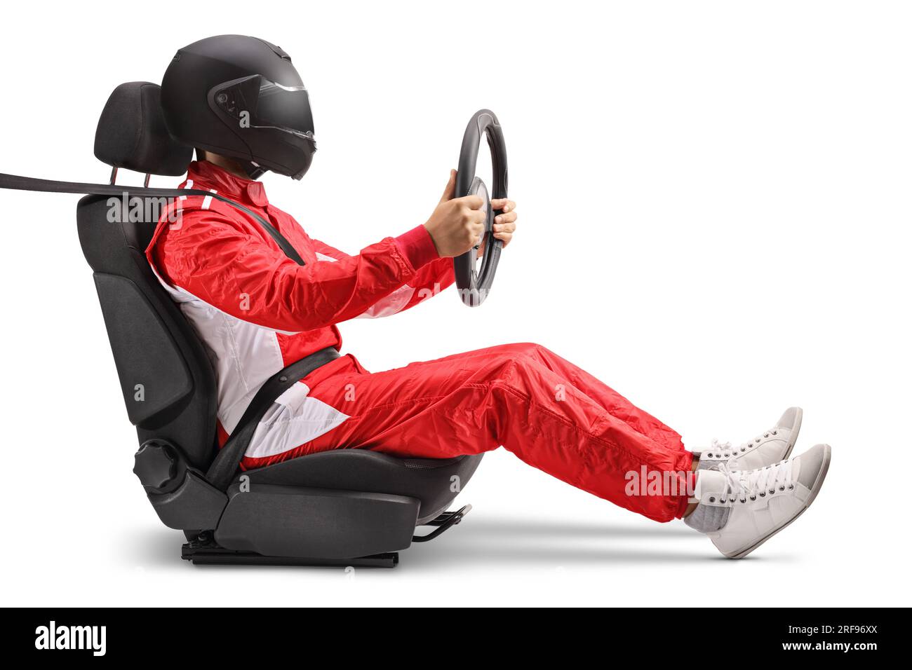 Racer with a helmet sitting in a car wheel and holding a steering wheel ...