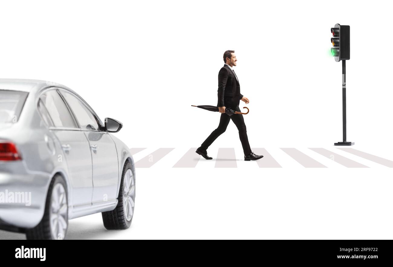 Car in front of a pedestrian crossing and man walking isolated on white ...