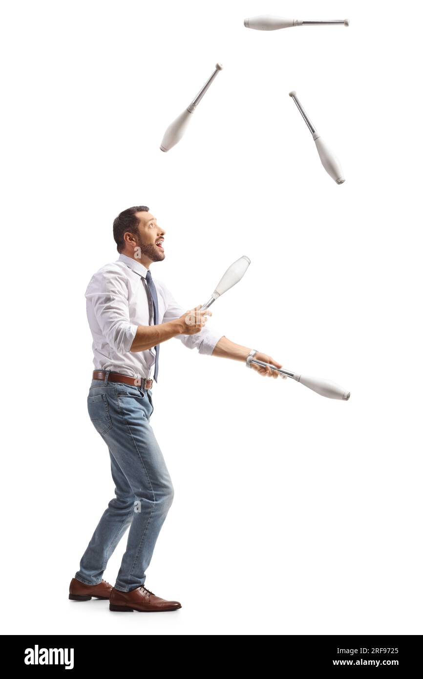 Full length profile shot of a businessman juggling isolated on white ...