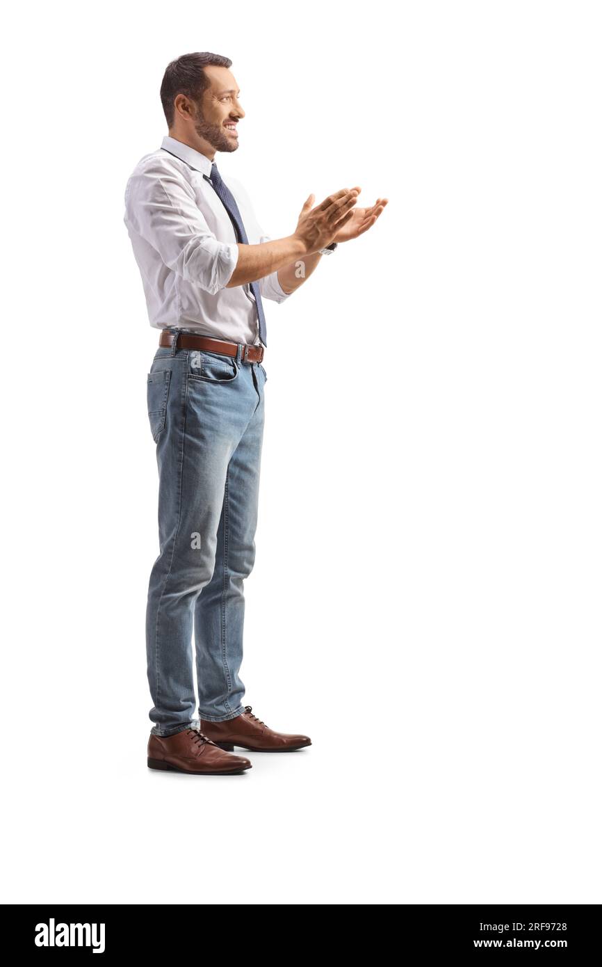 Full length profile shot of a young man clapping with hands isolated on ...