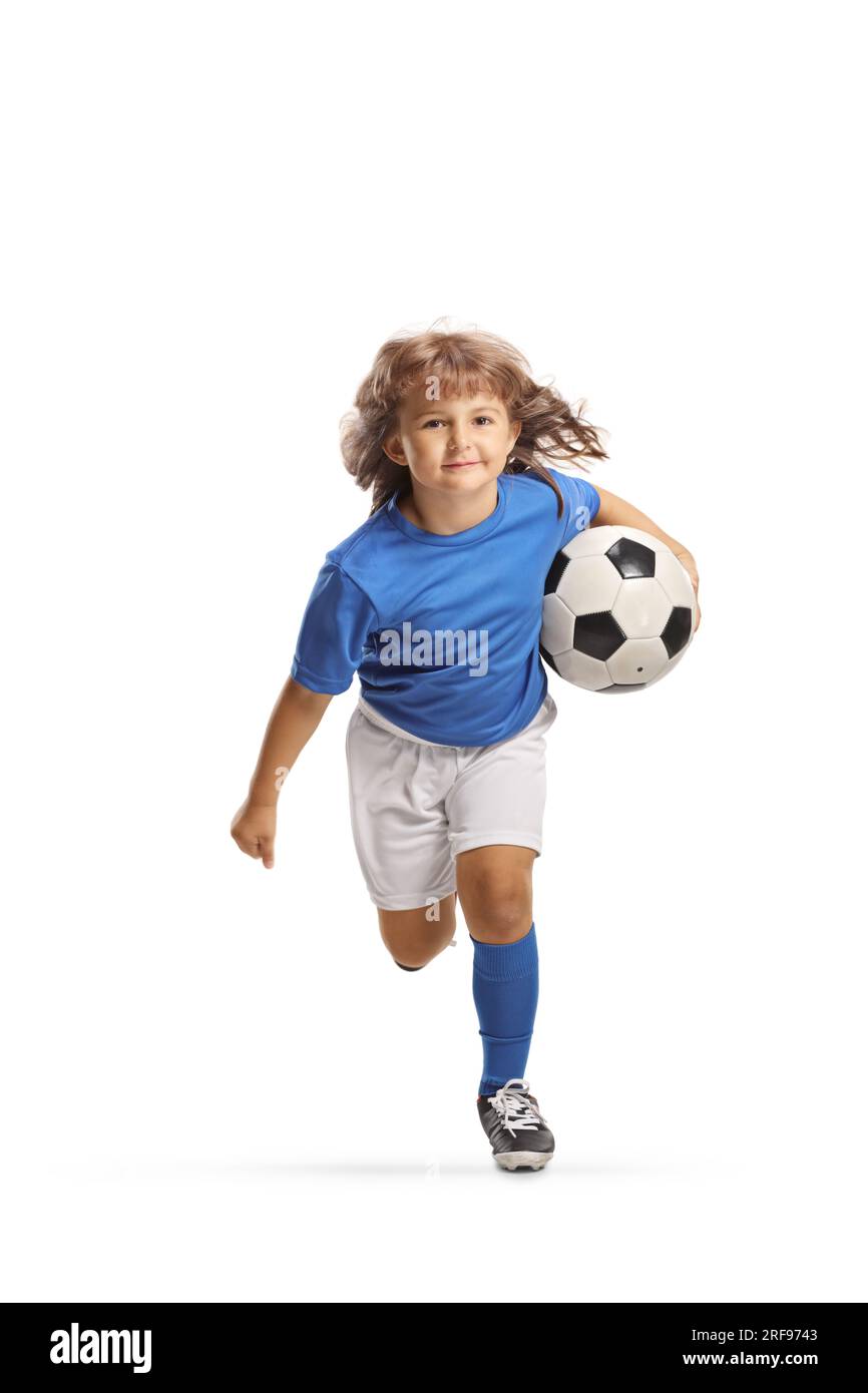 GIrl in football clothes running with ball under arm isolated on white ...