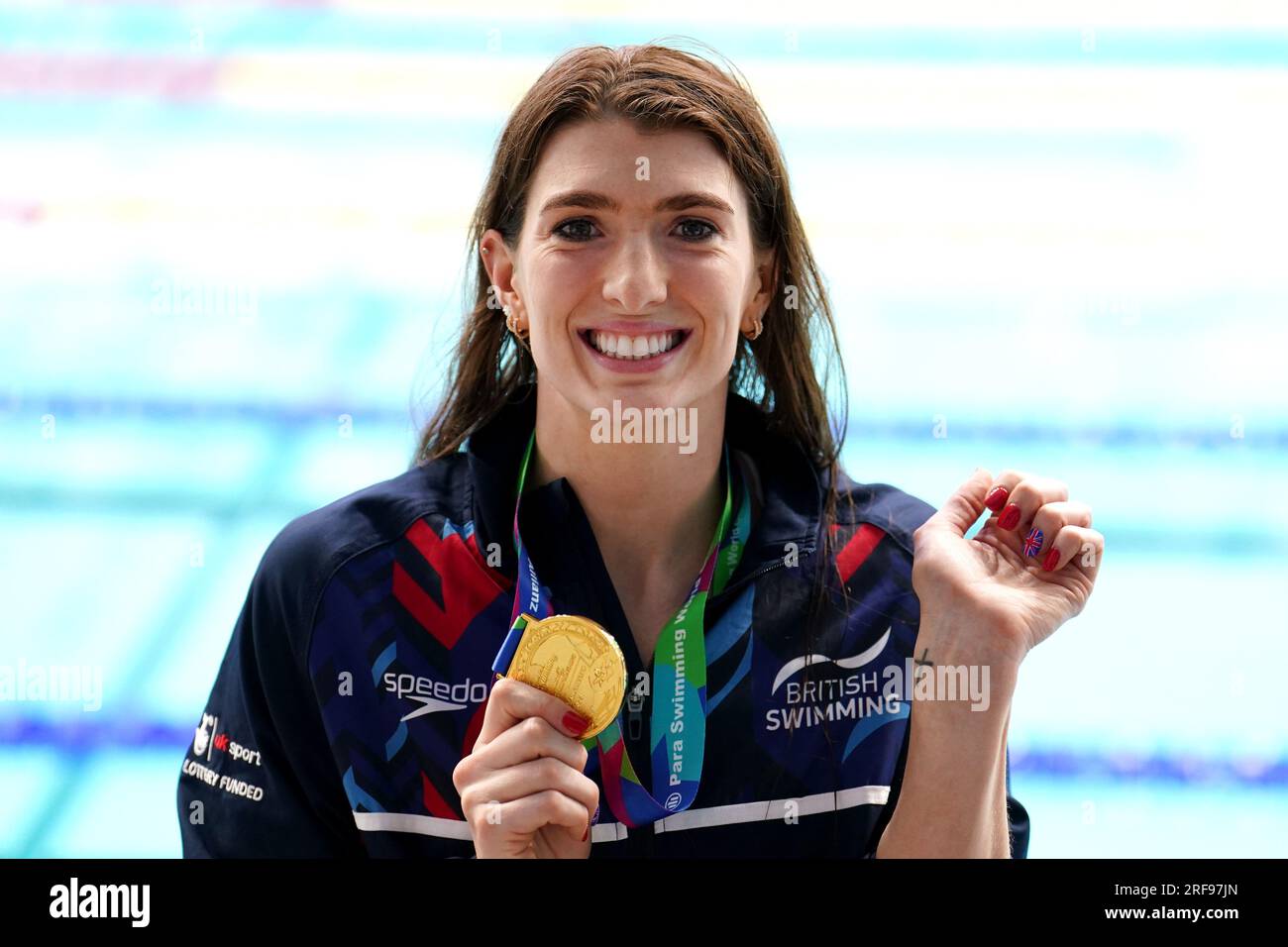 Great Britain's Bethany Firth celebrates with the gold medal after ...