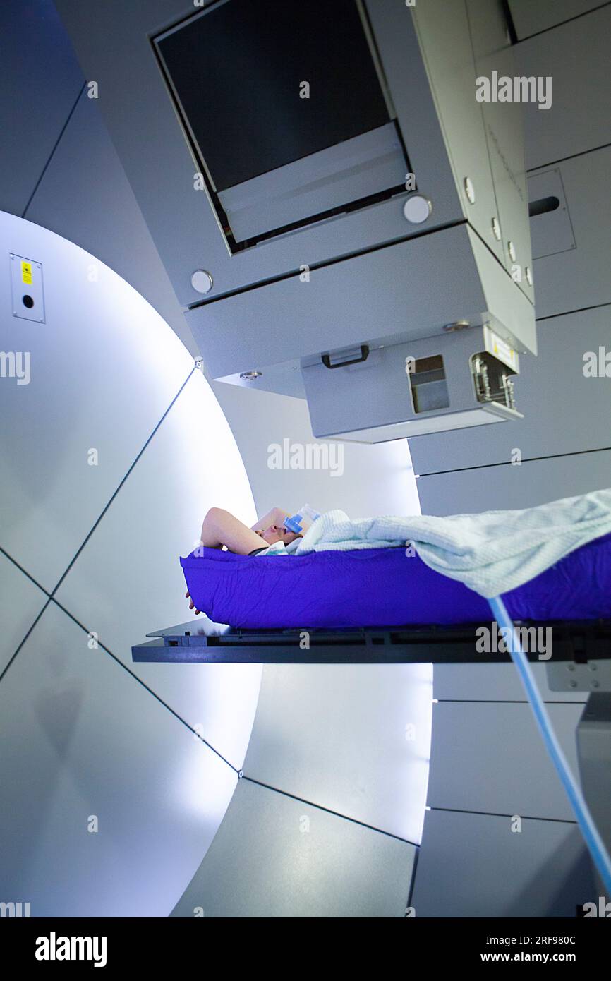 Proton therapy irradiates cancer cells with a beam of protons in the ...