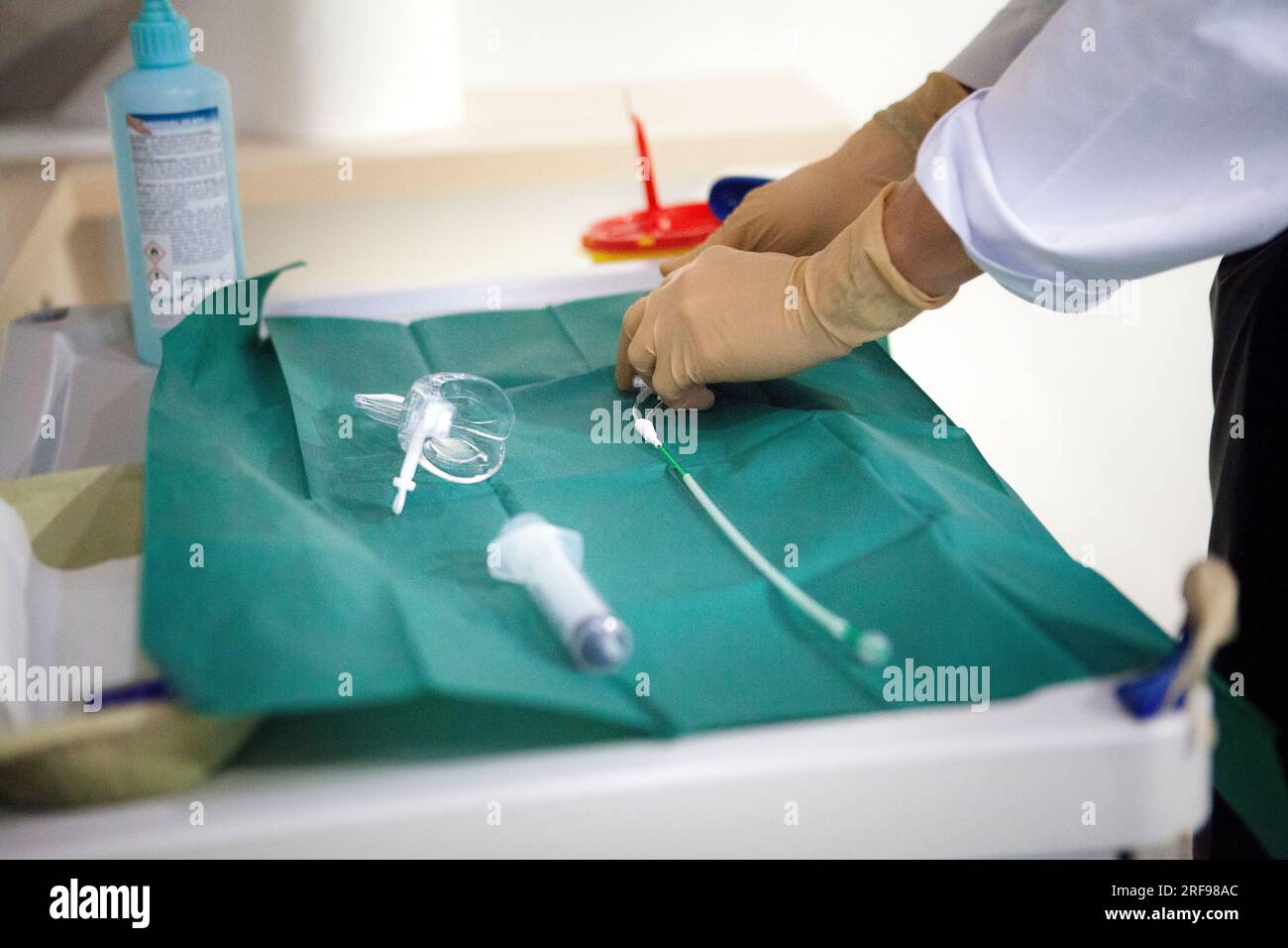 A radiologist is preparing the injection of the contrast product for a ...