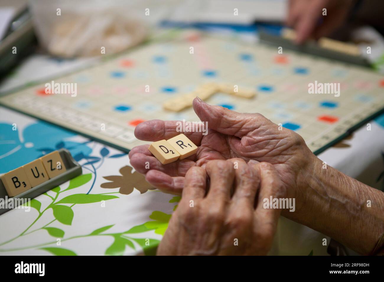 Elderly person playing in a retirement home Stock Photo - Alamy