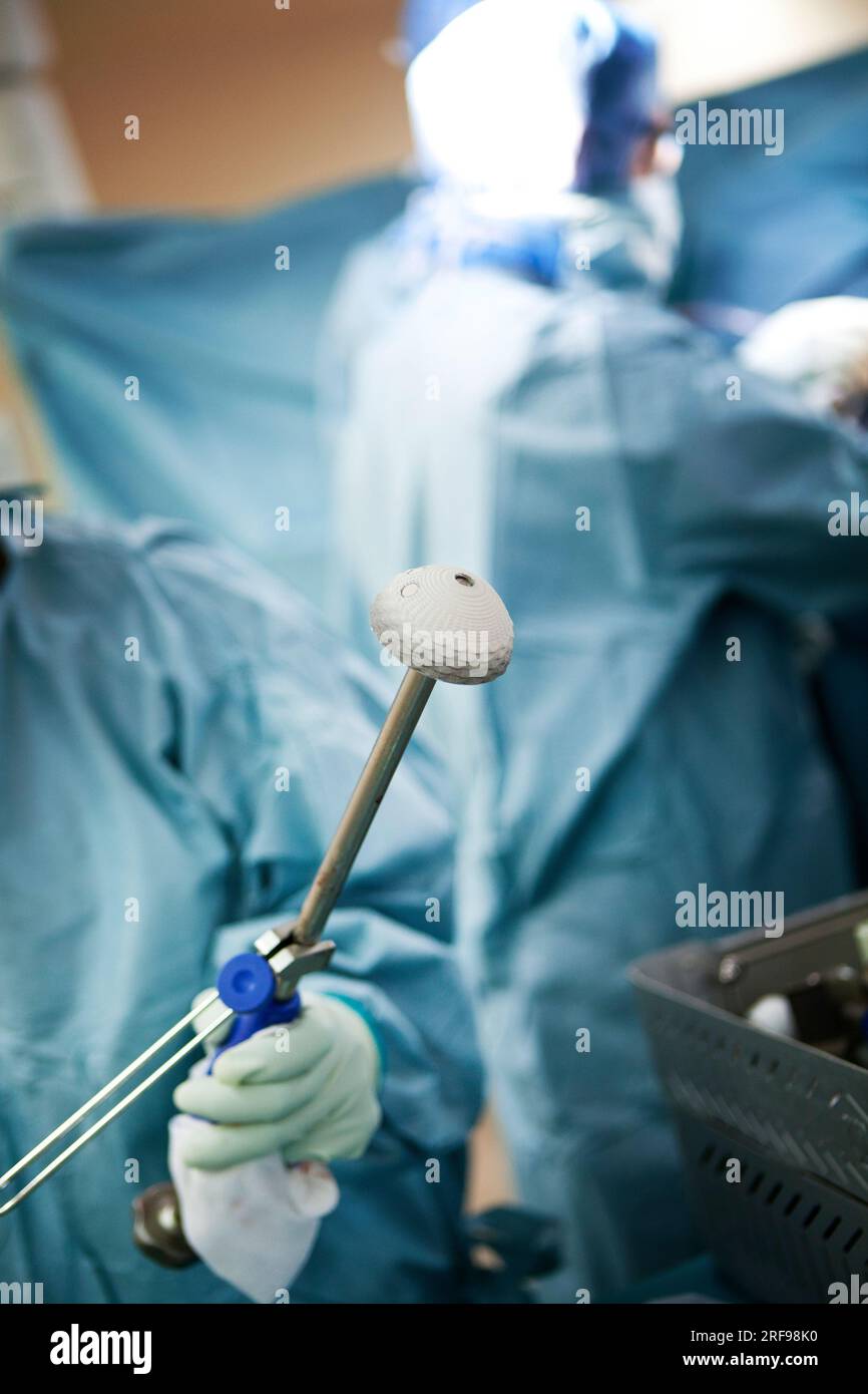 Orthopedic surgery in an operating room for the fitting of a hip ...
