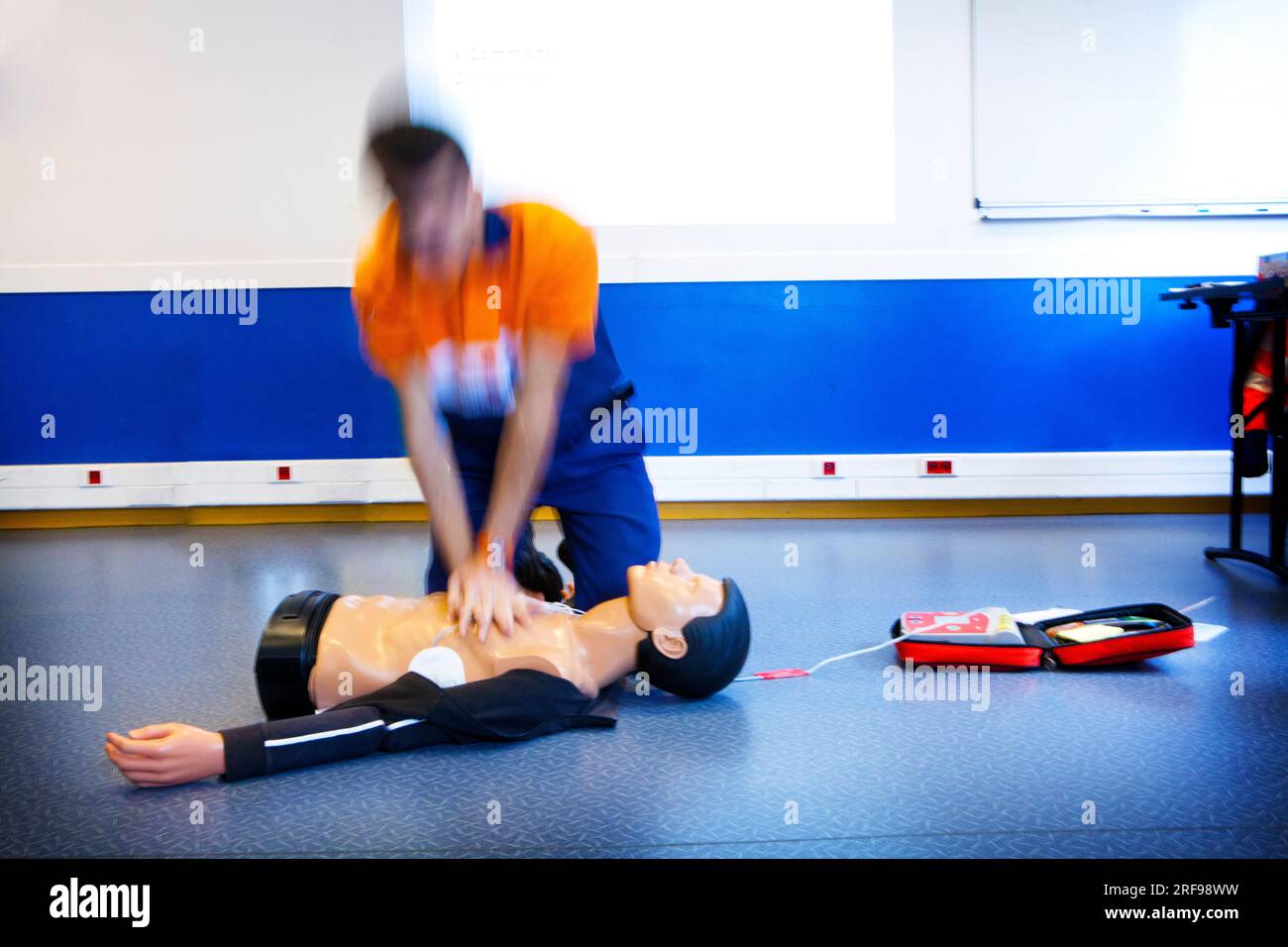 First aid training: demonstration of the use of a defibrillator on a ...
