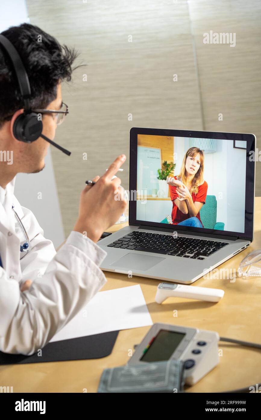 Doctor in remote consultation with 30-year-old female patient with ...