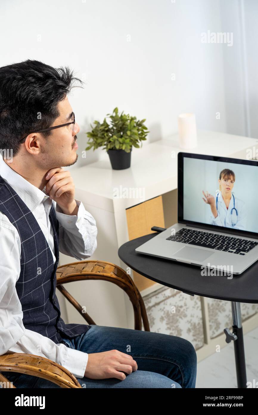 Female doctor in remote consultation with 30 year old patient Stock ...