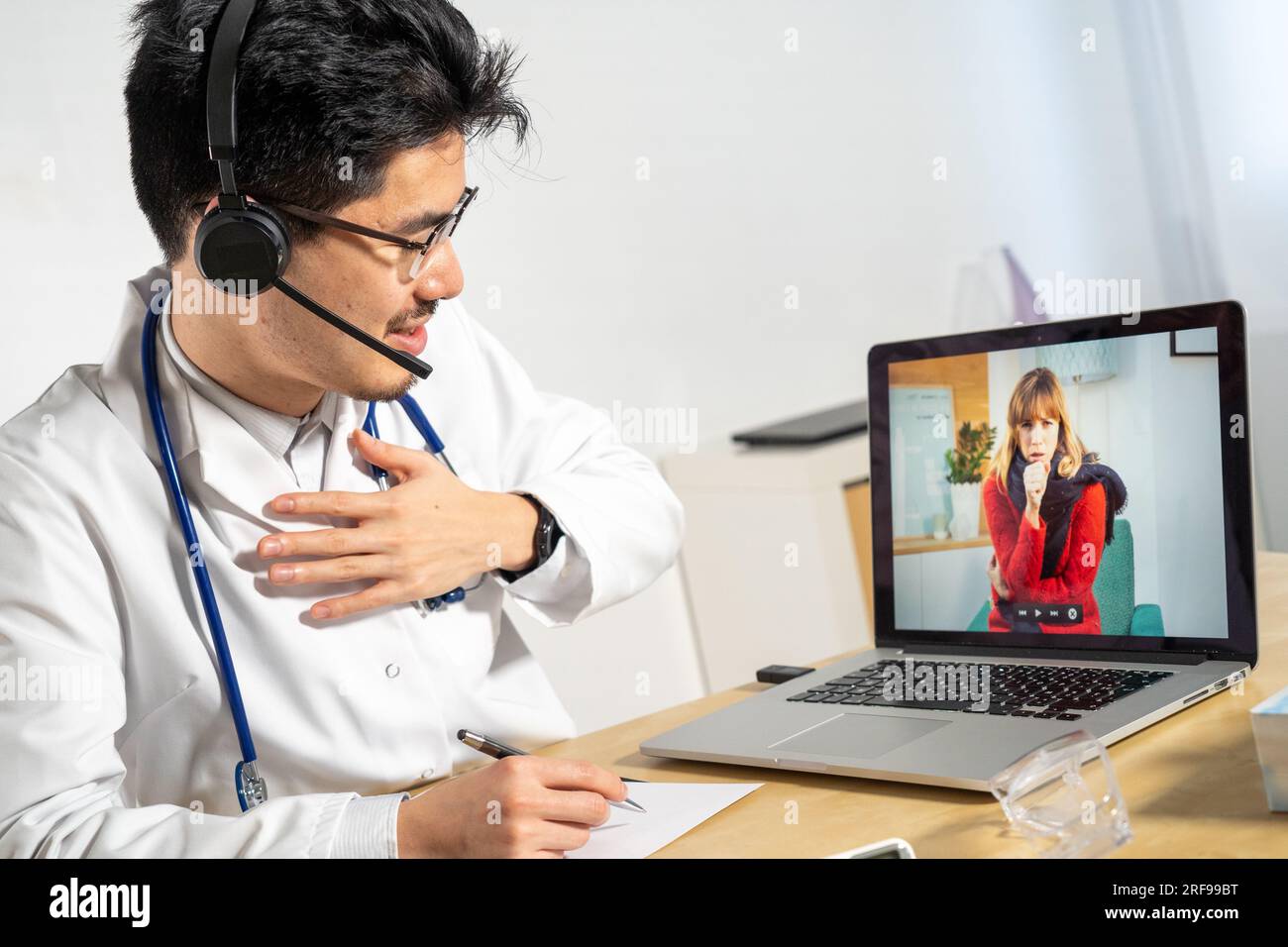 Doctor in remote consultation with 30 year old female patient with ...