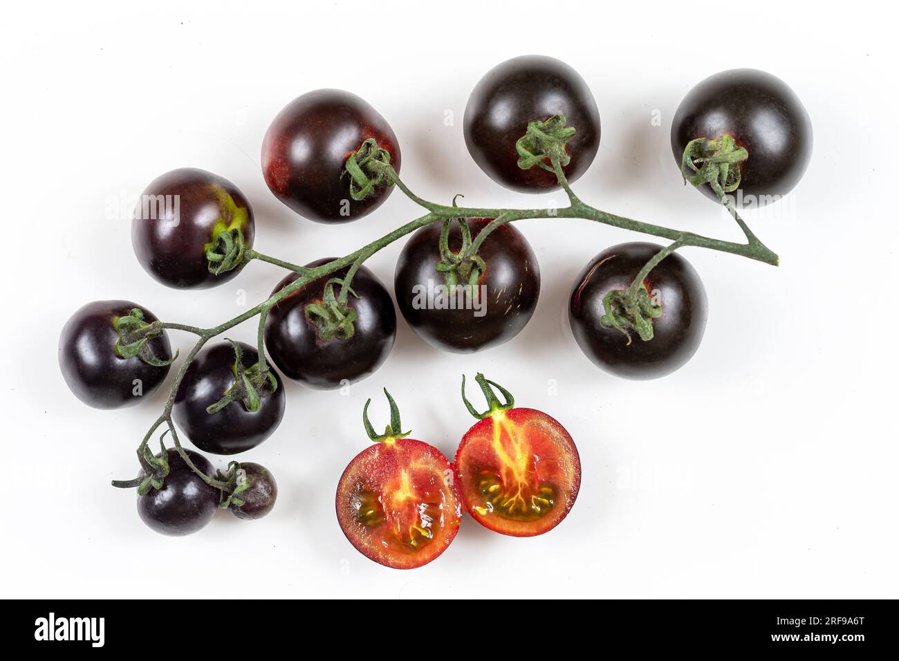 Bunch of yoom tomatoes on white background Stock Photo - Alamy