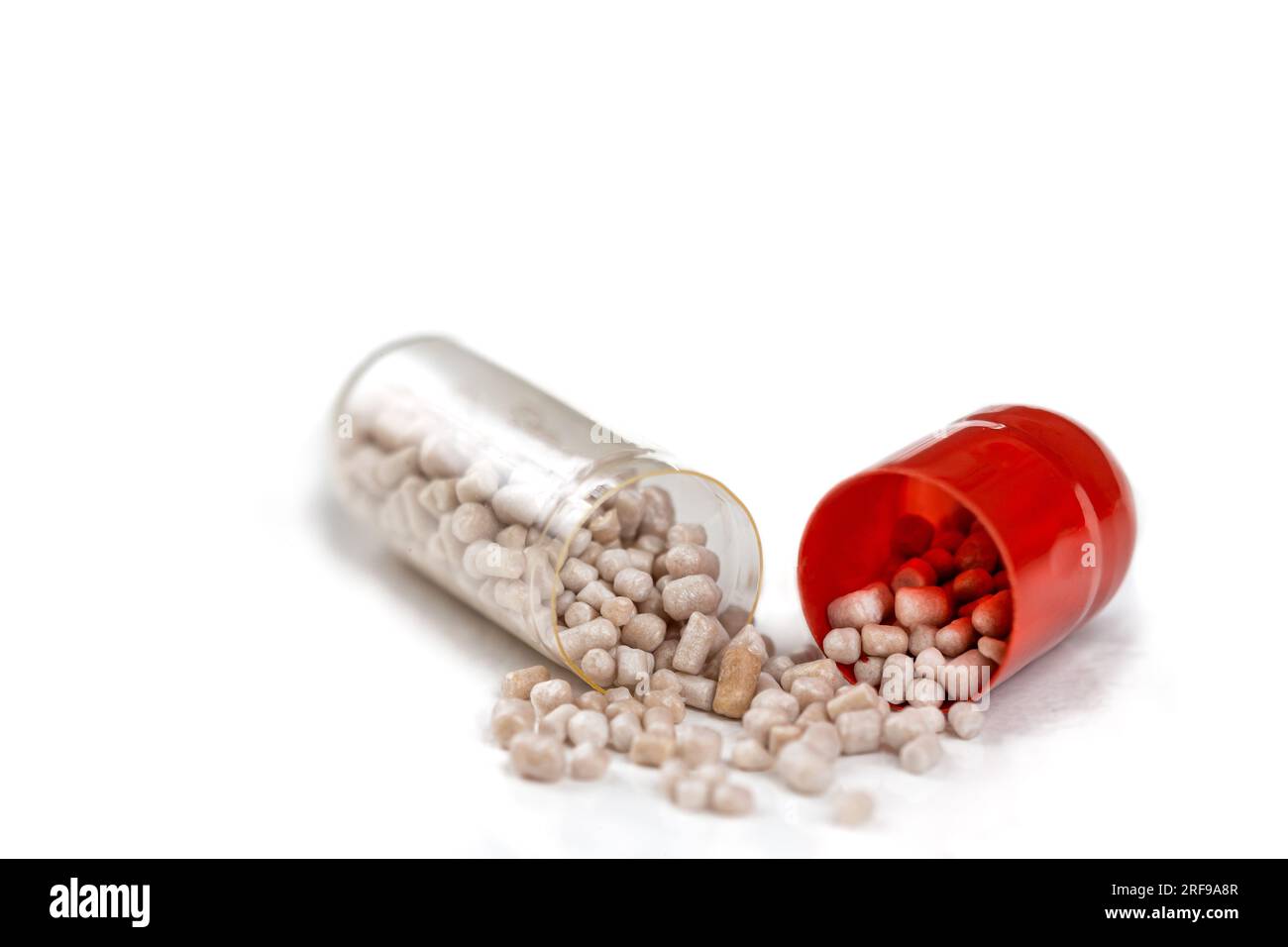 Opened drug capsule medicine Cut Out Stock Images & Pictures - Alamy