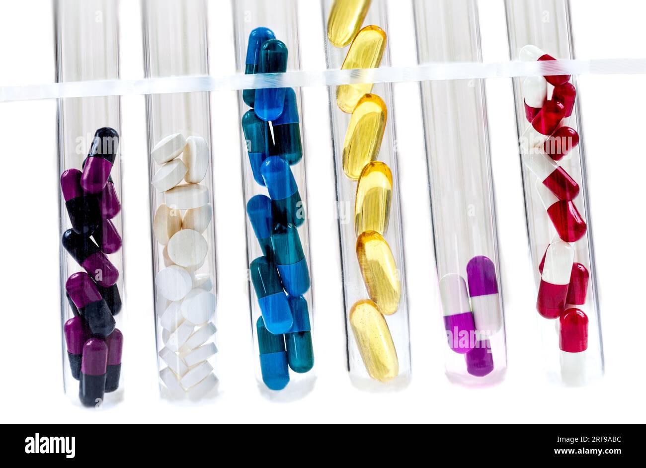 Capsules, capsules and tablets in test tubes Stock Photo - Alamy