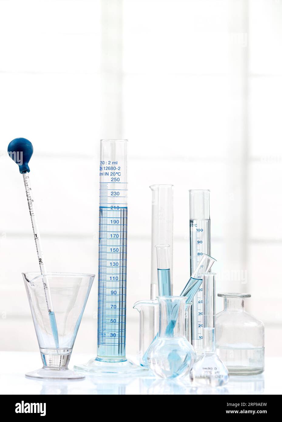 Set of laboratory glassware on plain background Stock Photo - Alamy