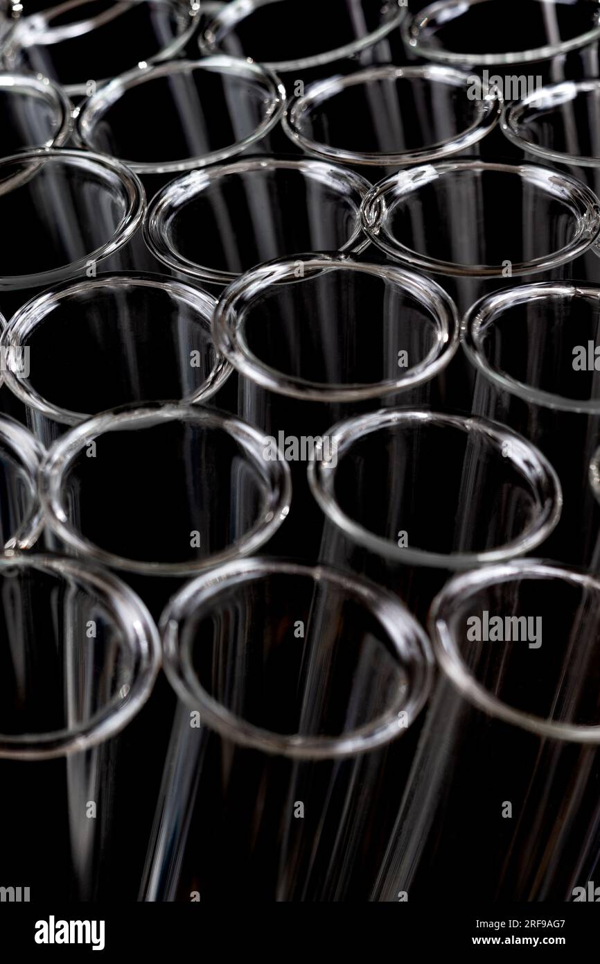 Close up of empty test tubes on black background Stock Photo - Alamy