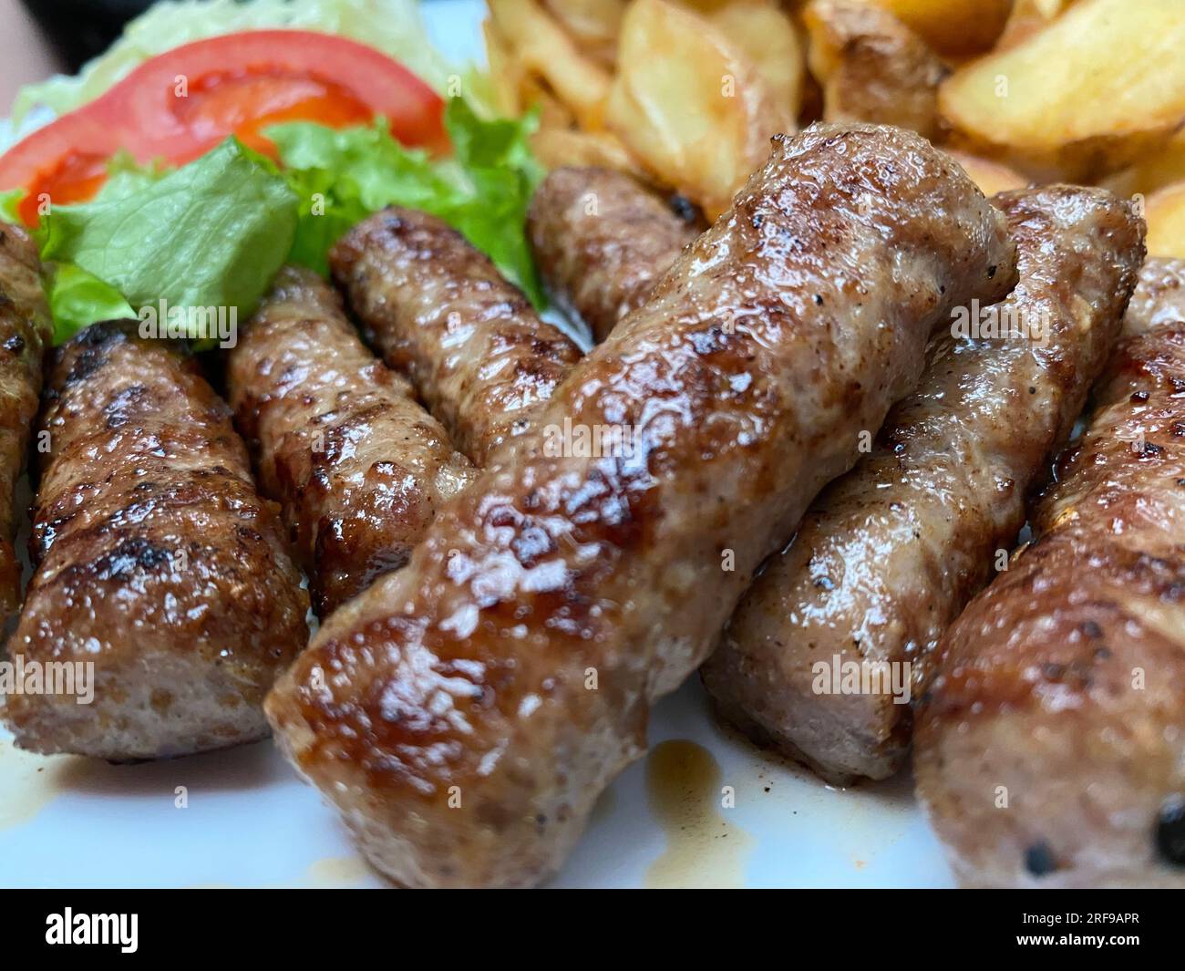 Close-Up of Cevapi: Traditional Bosnian Grilled Meat in Detail Stock ...