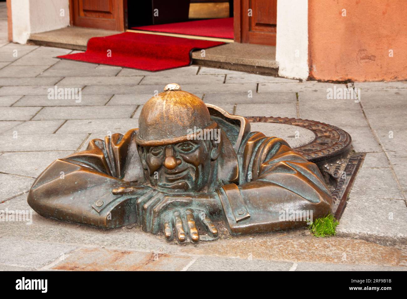 Cumil the watcher statue in the old town of Bratislava in Slovakia in ...