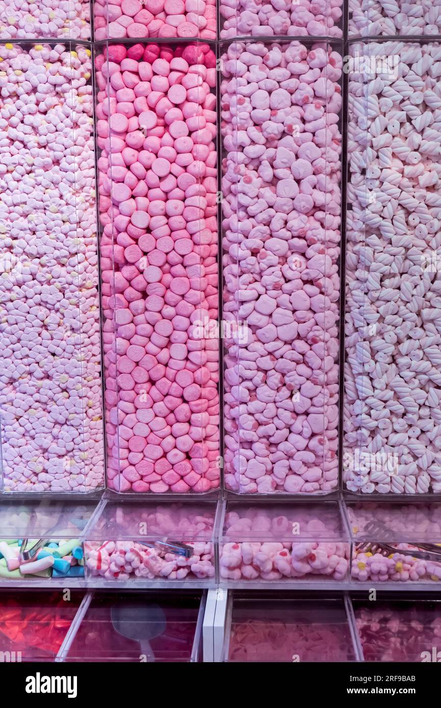 showcase of candy shop, transparent container with sweets, candy and ...