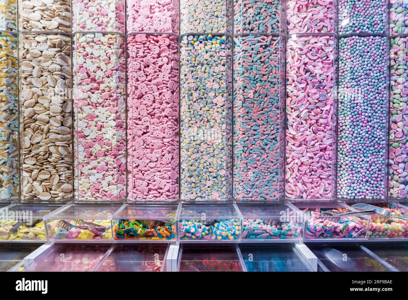 showcase of candy shop, transparent container with sweets, candy and ...