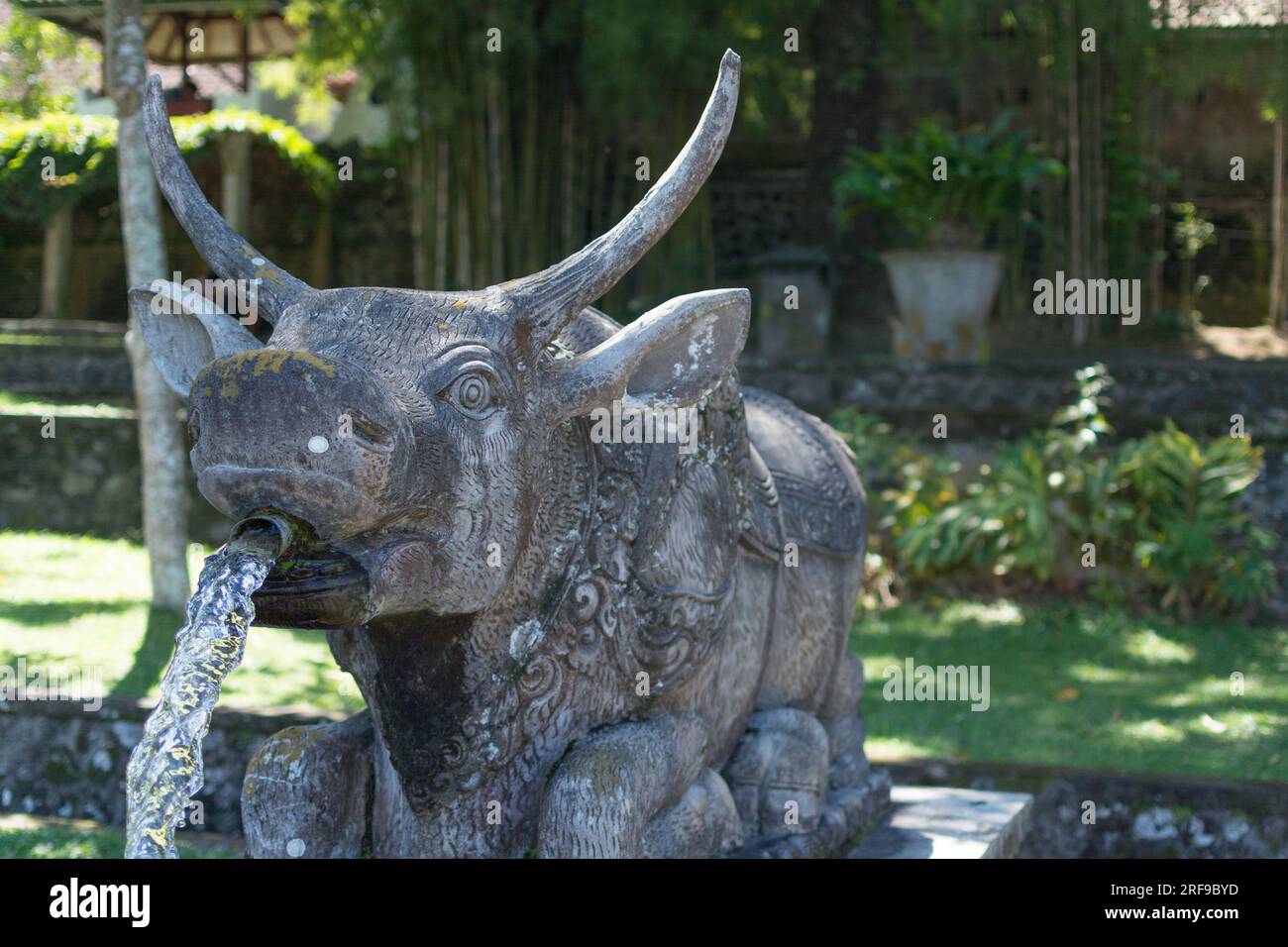 Stone Balinese Statues On Water In The Lake Water Palace Tirta Gangga ...