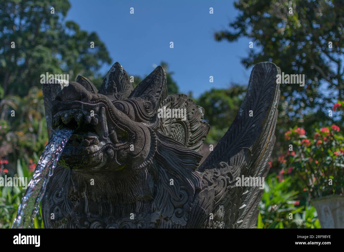 Stone Balinese Statues On Water In The Lake Water Palace Tirta Gangga ...