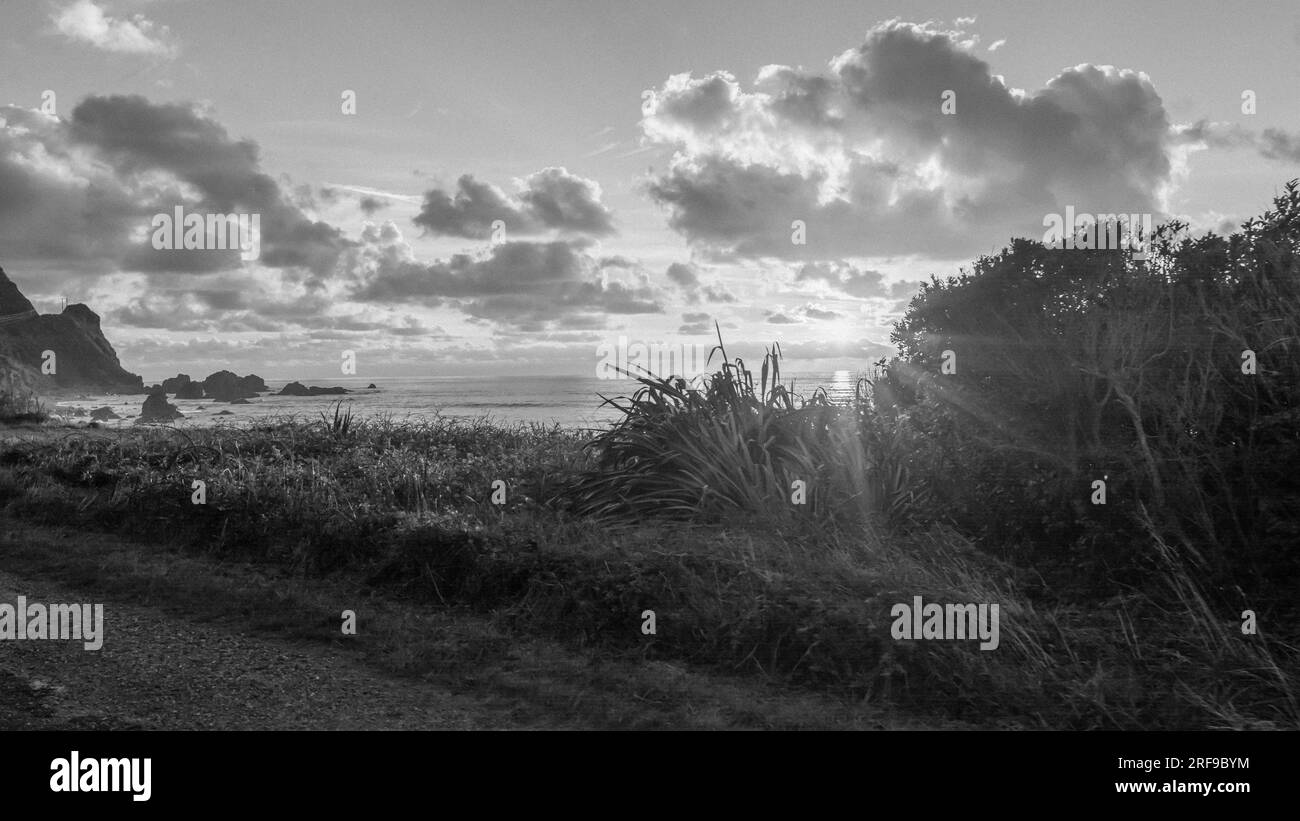 Dramatic view coast sunset Black and White Stock Photos & Images - Alamy