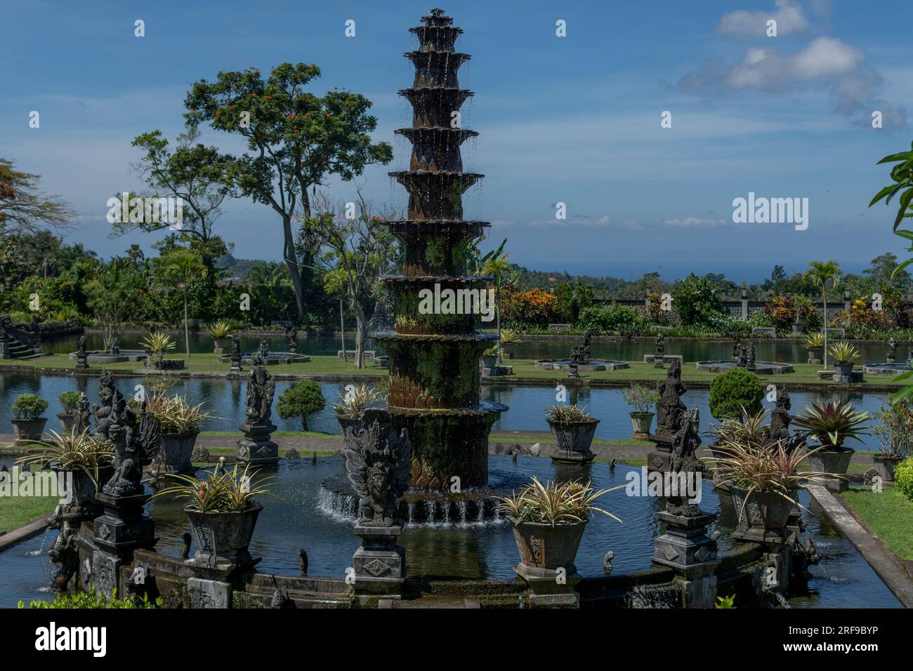 Stone Balinese Statues On Water In The Lake Water Palace Tirta Gangga ...