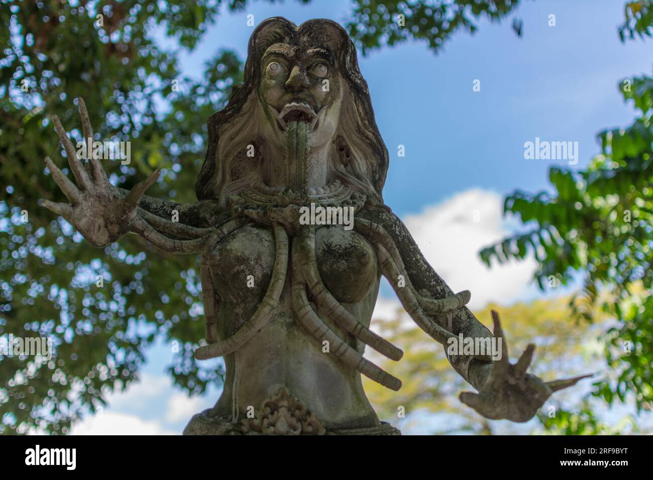 Stone Balinese Statues On Water In The Lake Water Palace Tirta Gangga ...