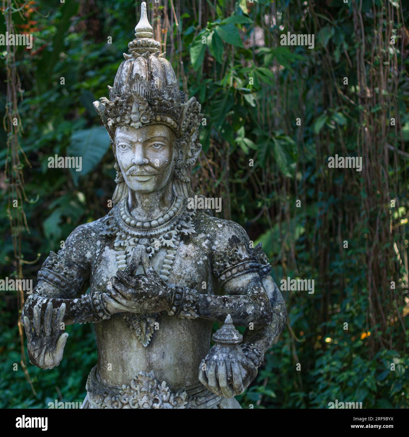 Stone Balinese Statues On Water In The Lake Water Palace Tirta Gangga ...
