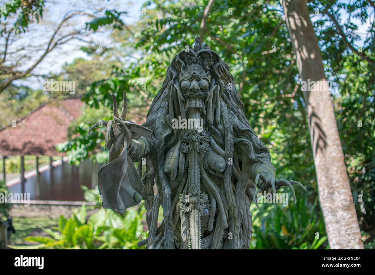 Stone Balinese Statues On Water In The Lake Water Palace Tirta Gangga ...