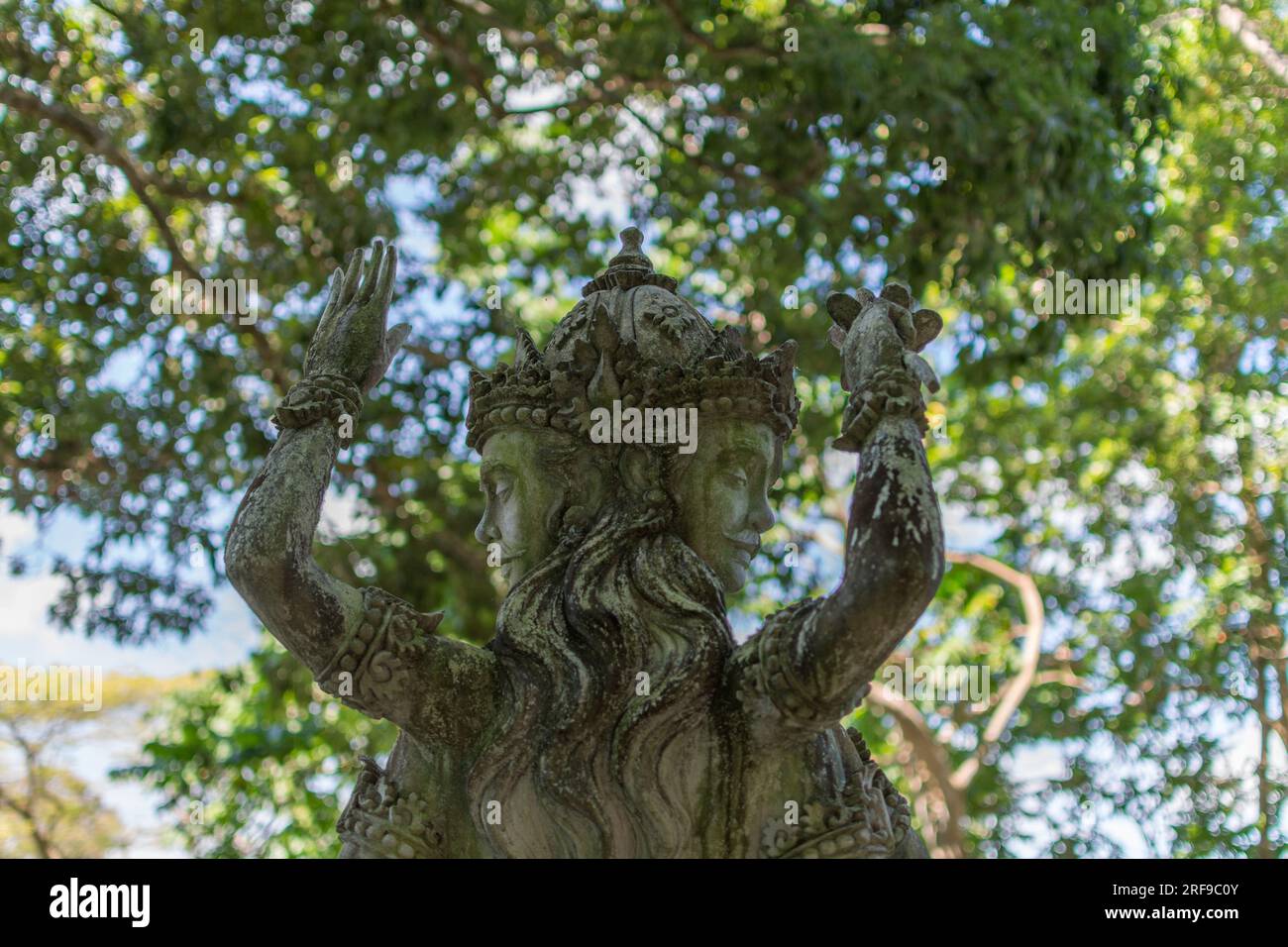 Stone Balinese Statues On Water In The Lake Water Palace Tirta Gangga ...