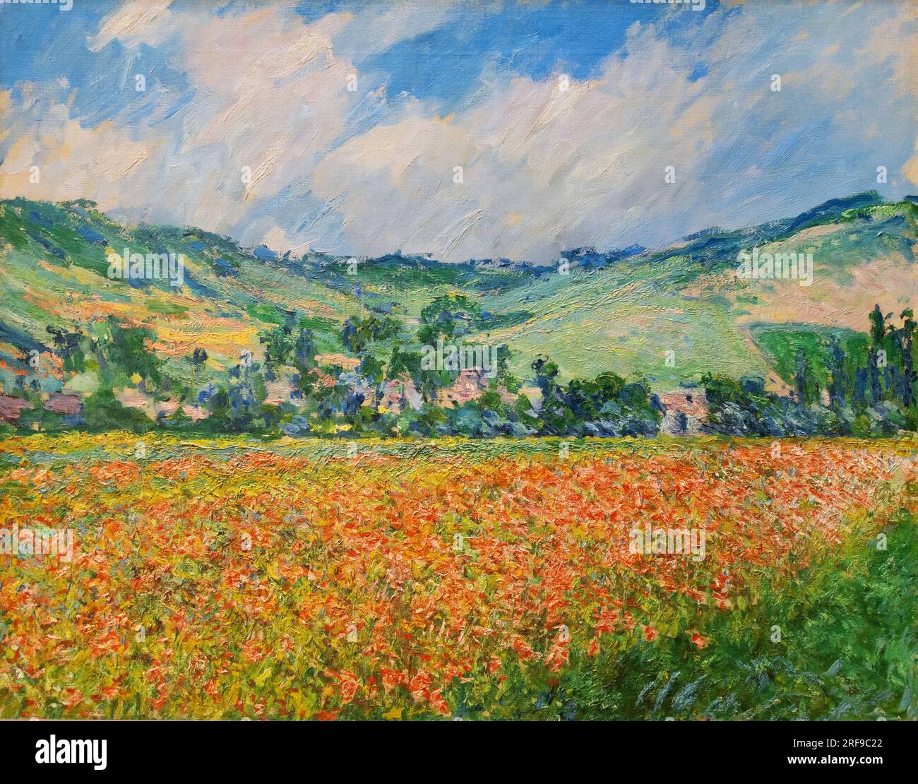 Claude Monet painting; Champ de Coquelicots, environment de Giverny ...