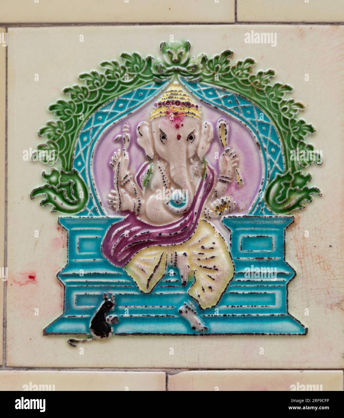A tile showing the Hindu deity Ganesh or Ganesha with his vaahana ...