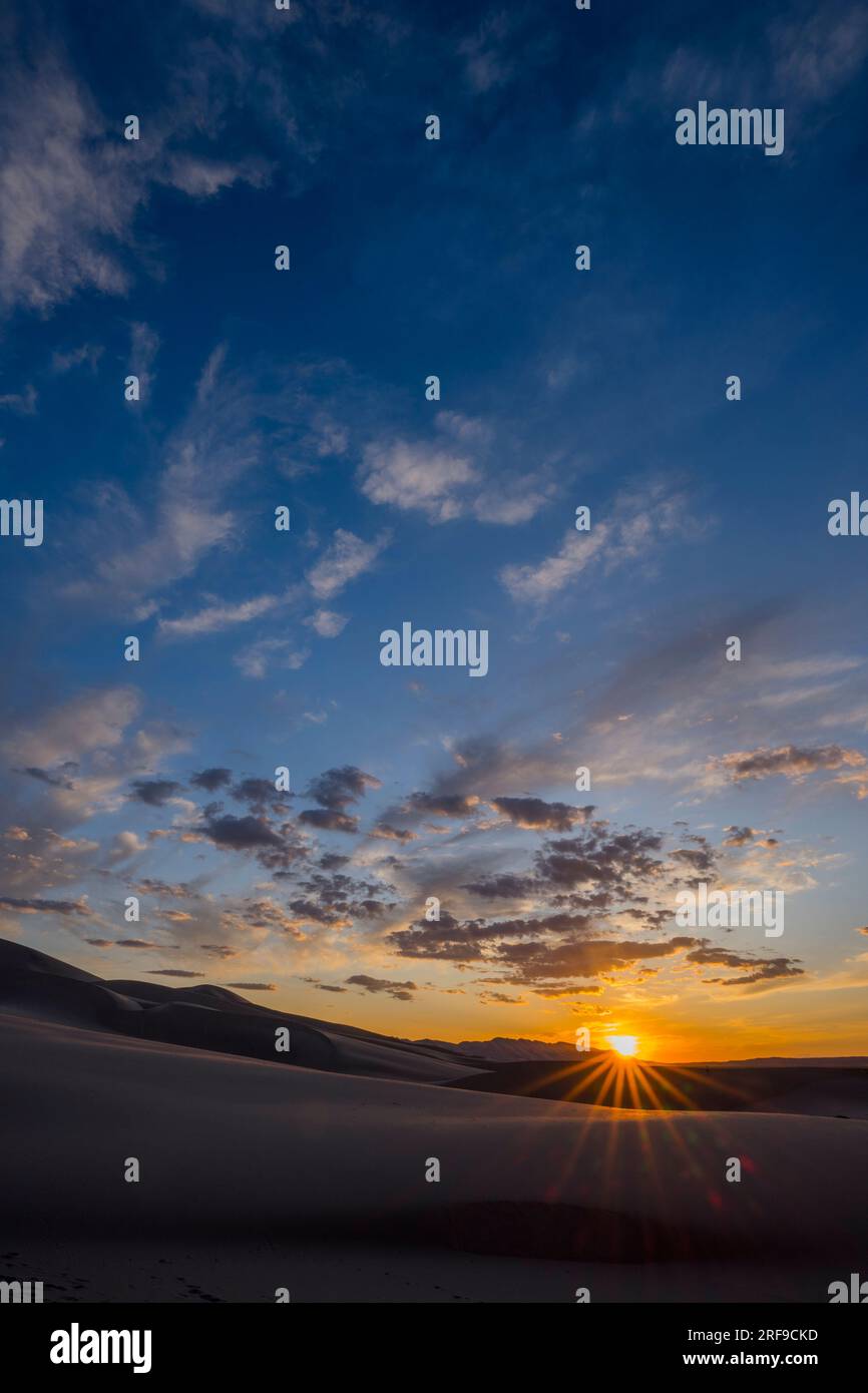Sunset over the Hongoryn Els sand dunes in the Gobi Desert in southern ...