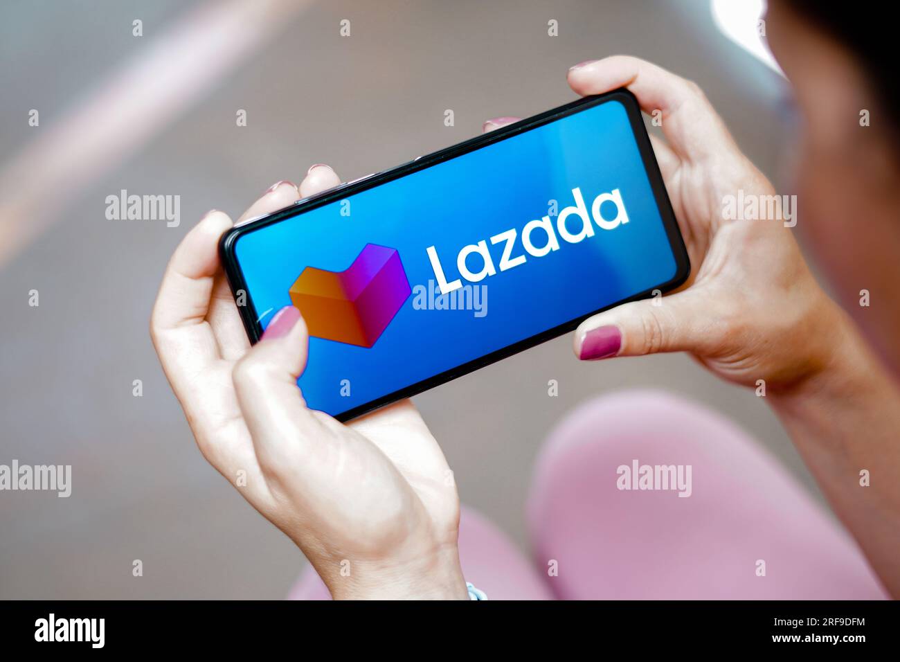 In this photo illustration, the Lazada logo is seen displayed on a ...