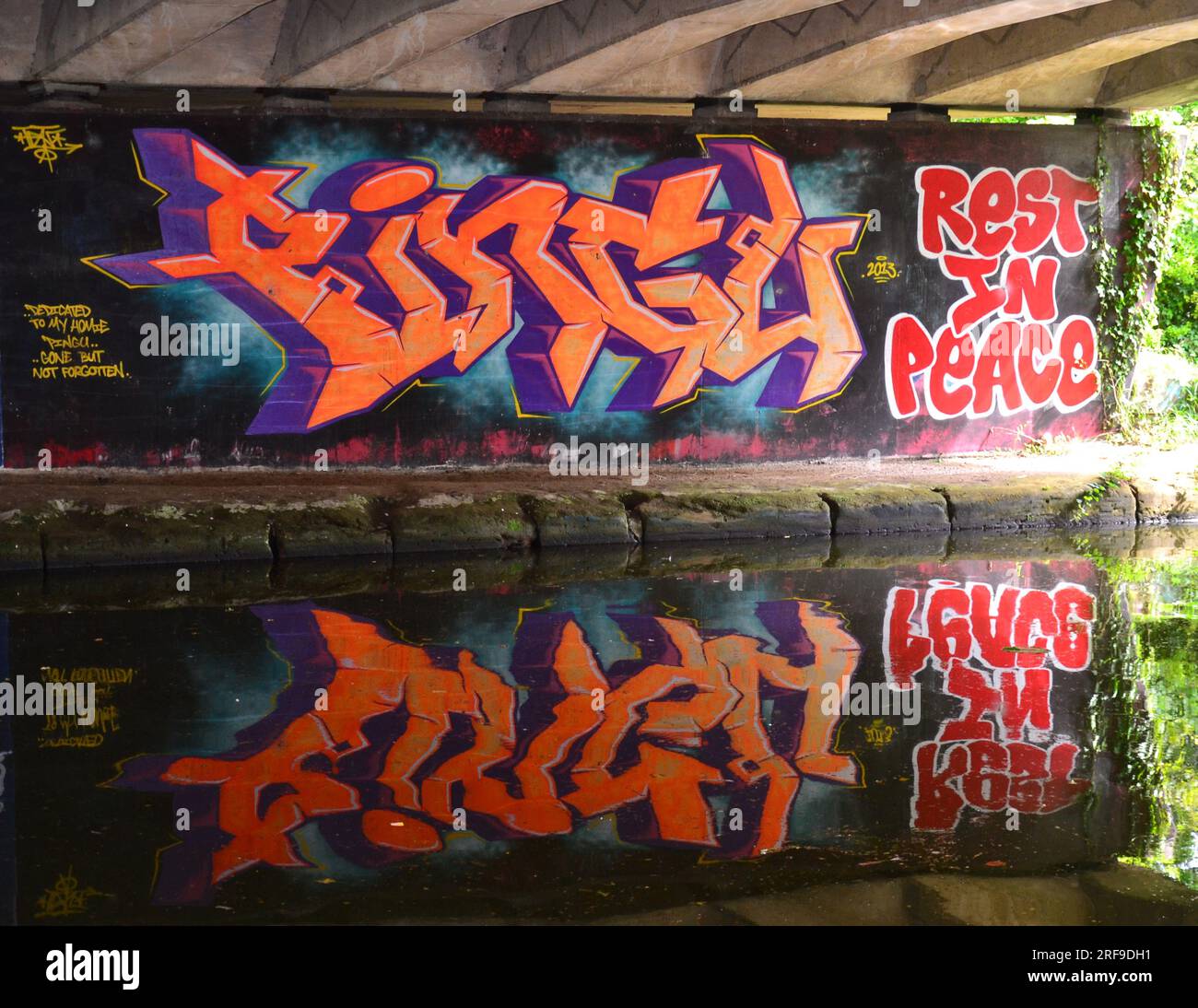 Wall art under a road bridge beside the Bridgewater Canal, with ...