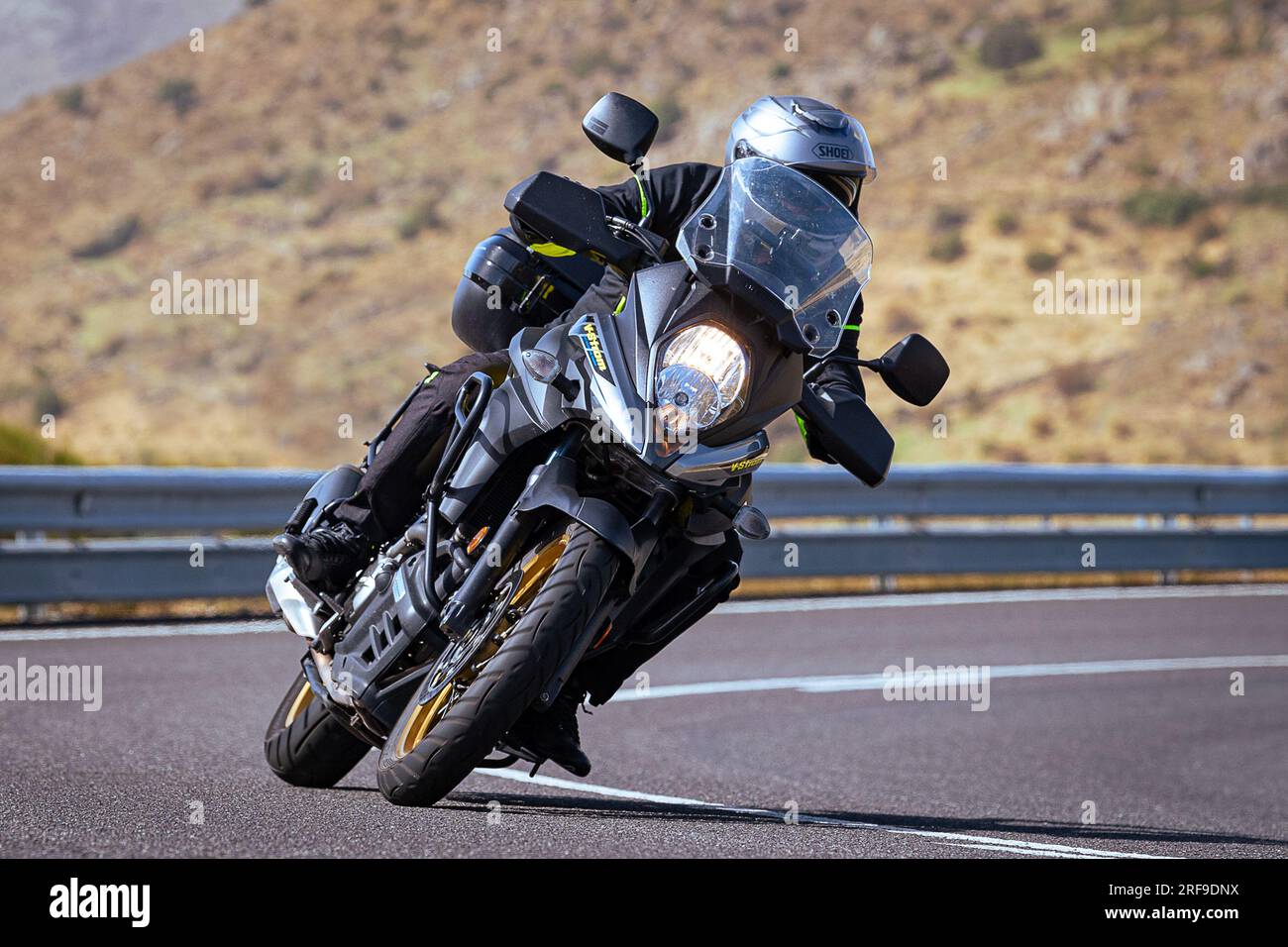 motorcyclist taking a sharp curve on his bike. Photograph taken in the ...