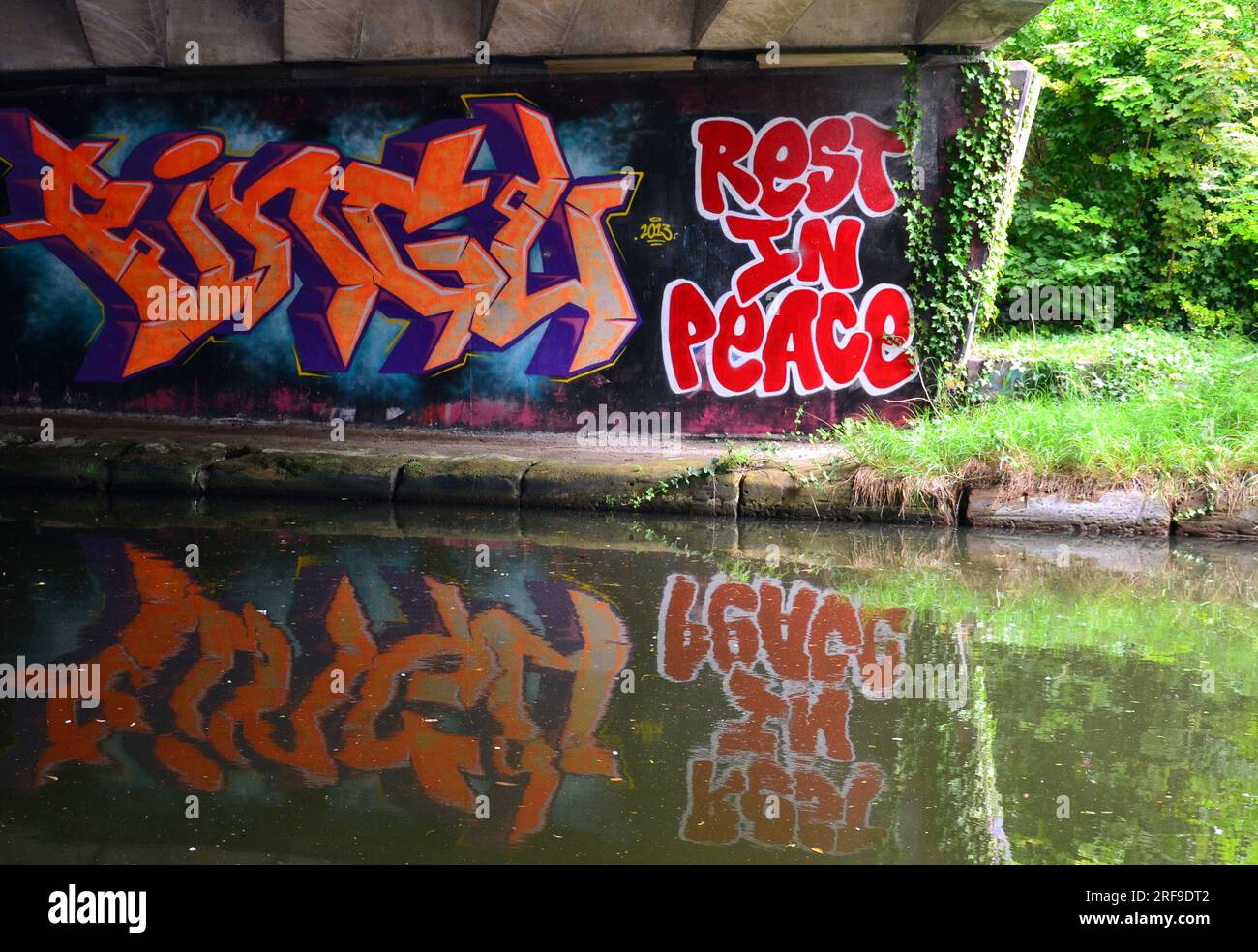 Wall art under a road bridge beside the Bridgewater Canal, with ...