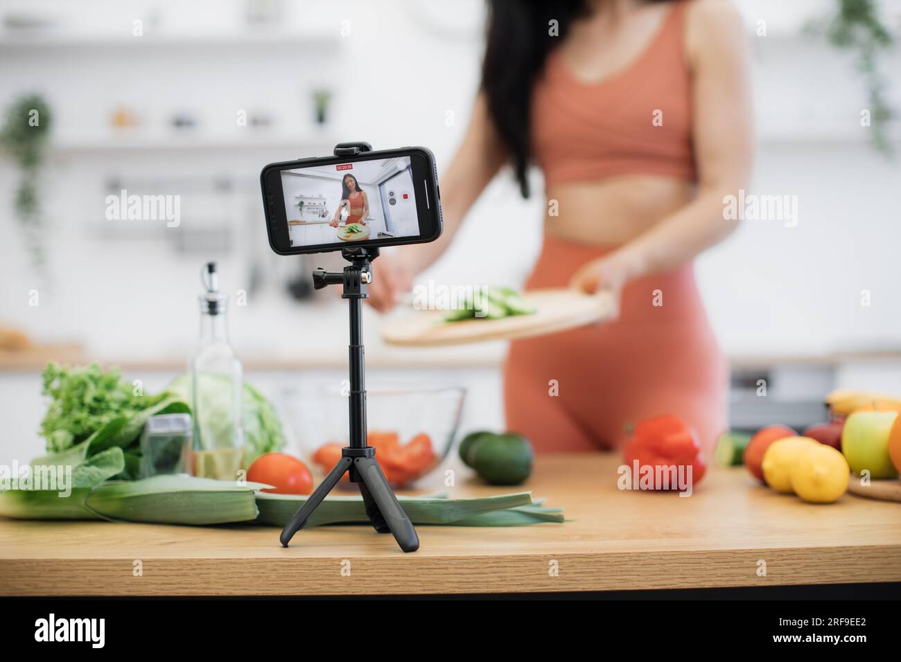 Young woman recording cooking tutorial hi-res stock photography and ...