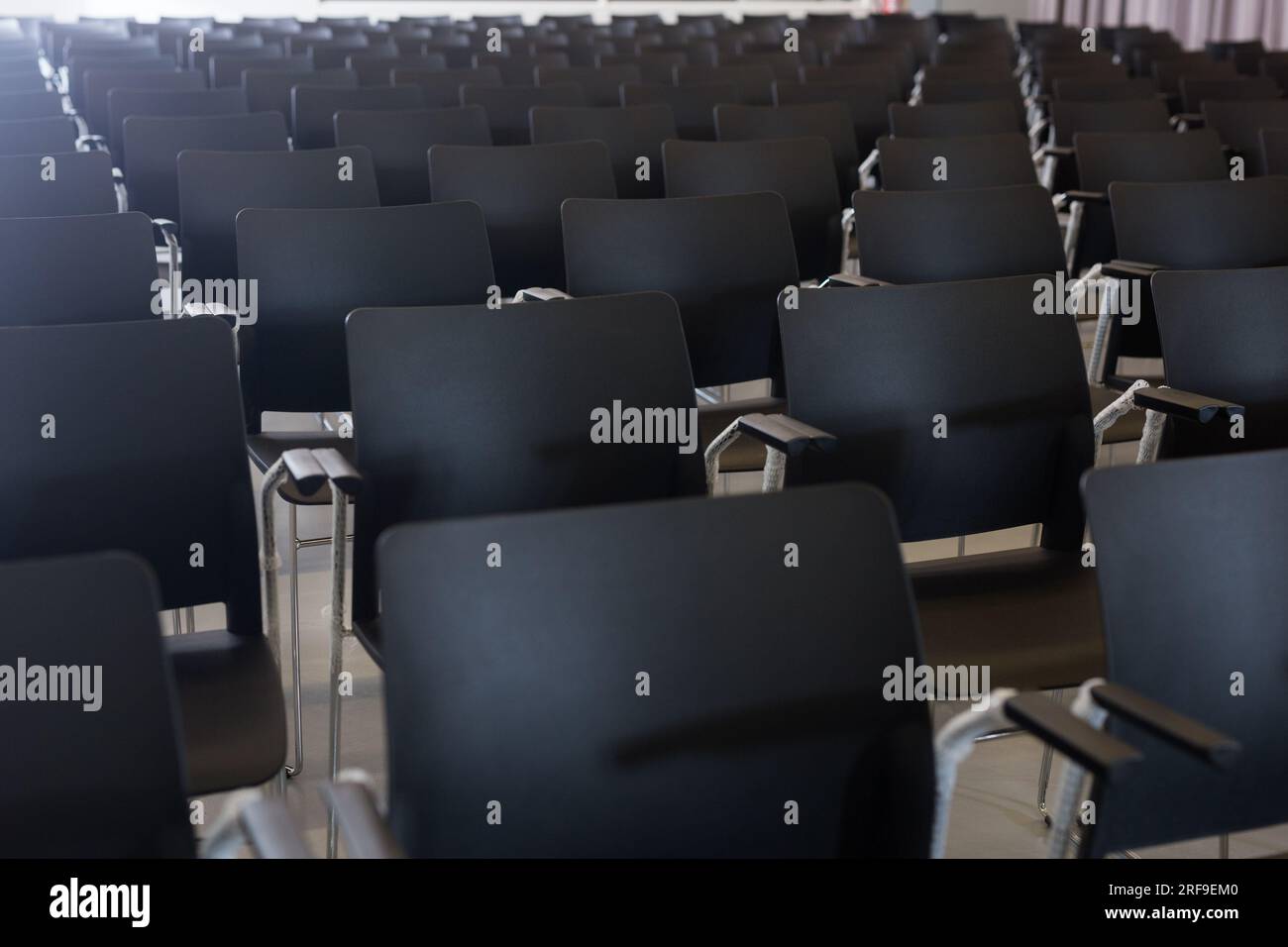 Plastic chairs in conference room Stock Photo - Alamy